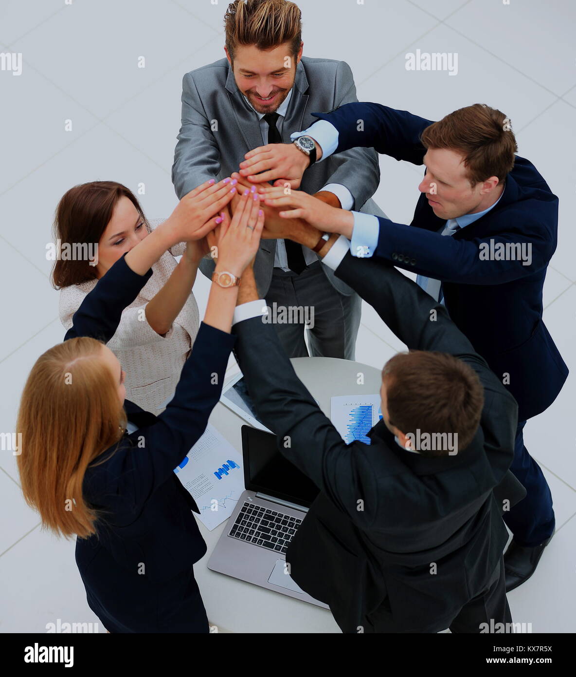 Group of business people celebrating their teamwork with a high Stock ...