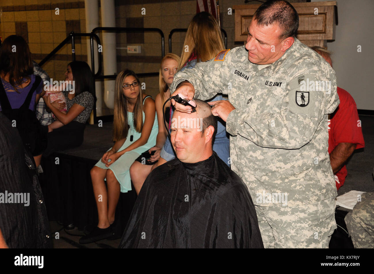 US Army National Guard sponsored head shave for good cause Stock Photo ...