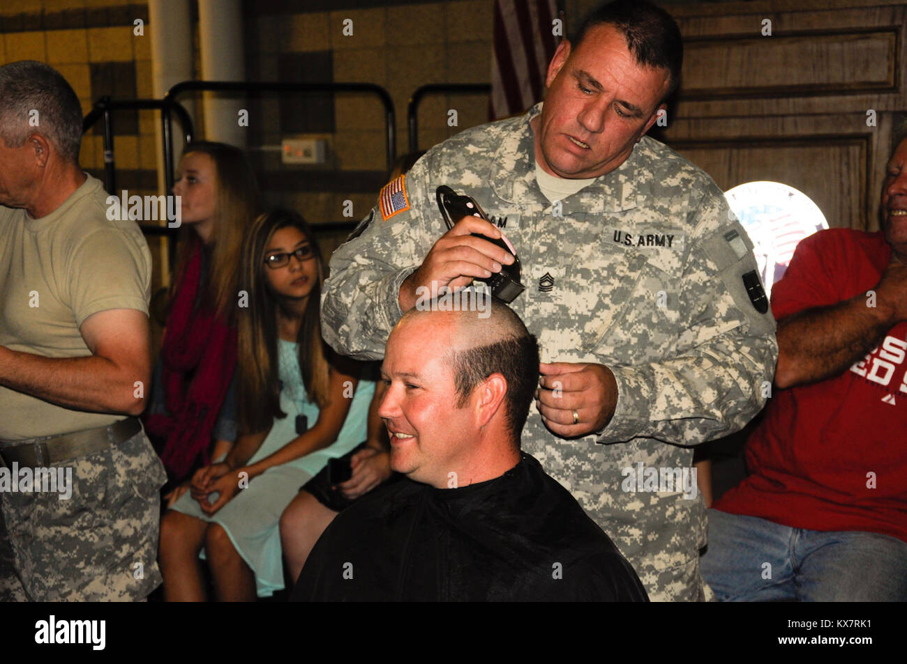 US Army National Guard sponsored head shave for good cause Stock Photo ...