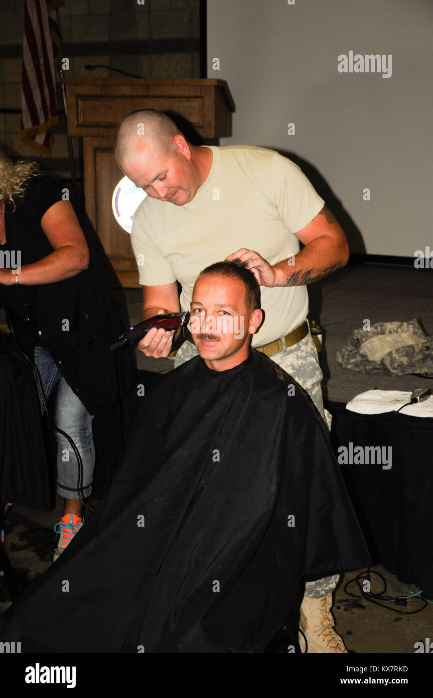 US Army National Guard sponsored head shave for good cause Stock Photo ...