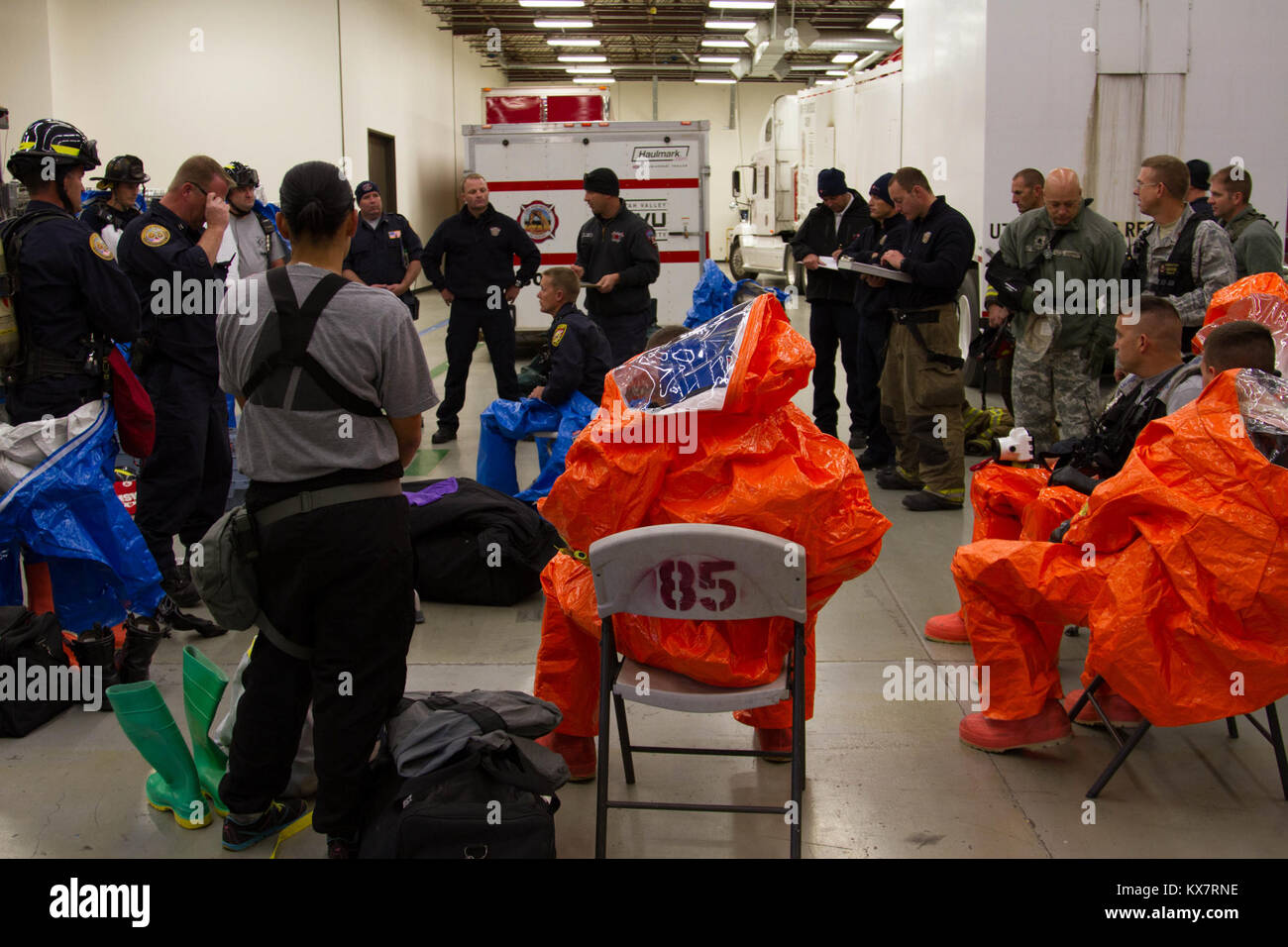 PROVO, Utah - Police officers, firefighters, soldiers and airmen listen ...