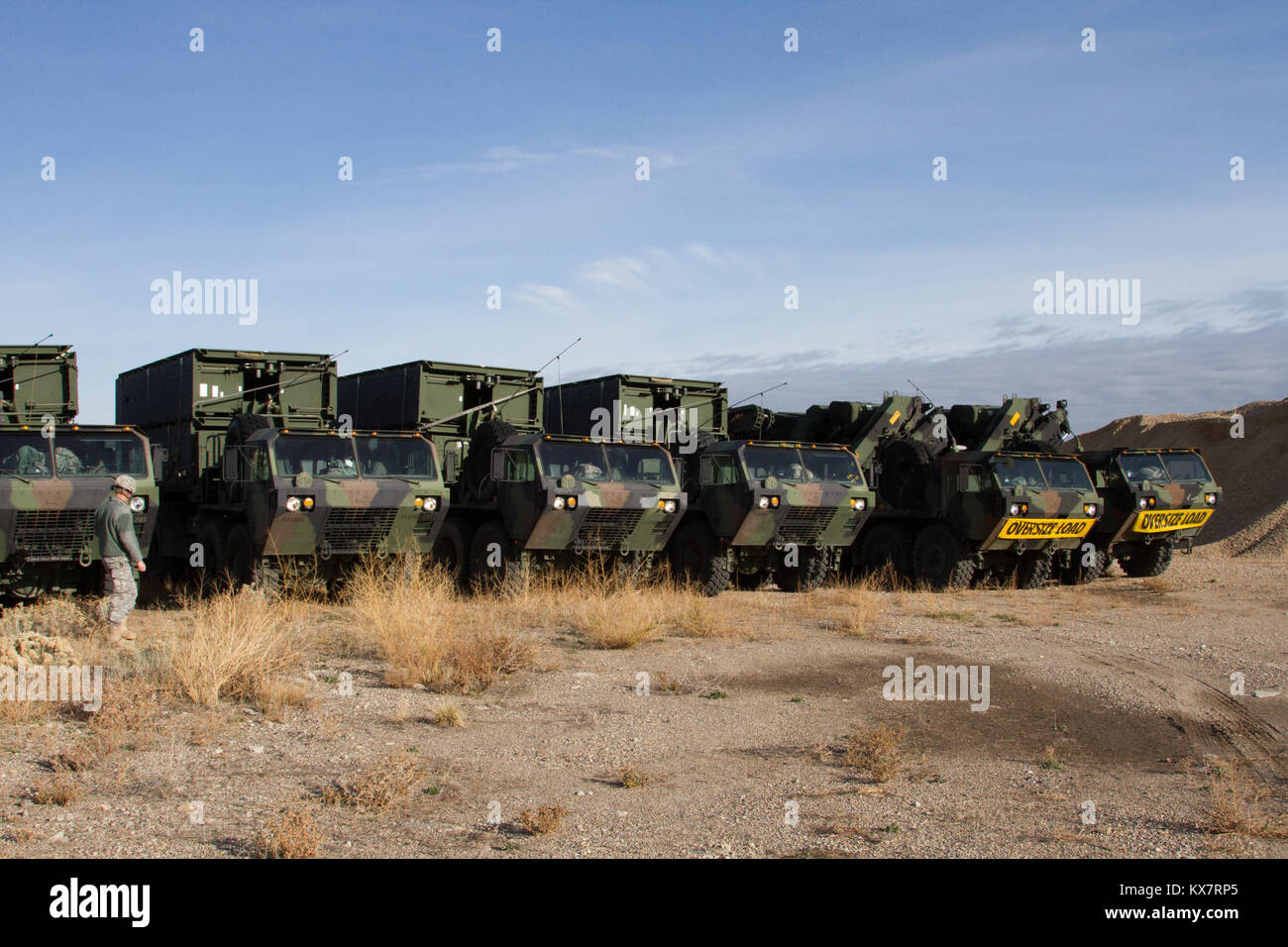 Large trucks belonging to the 1041st Engineering Multi-Roll Bridge ...