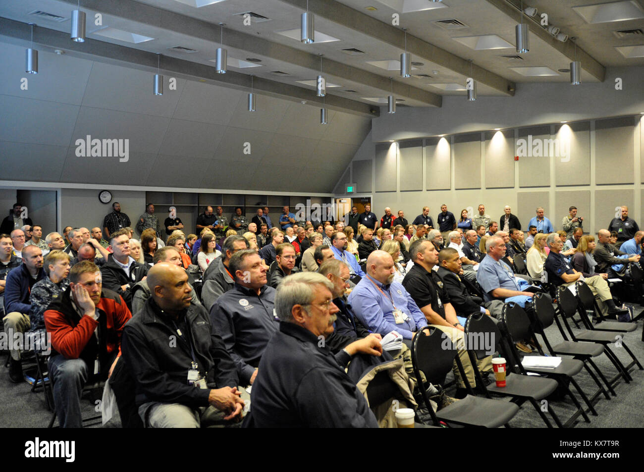Members of emergency response agencies gather for the opening briefing ...