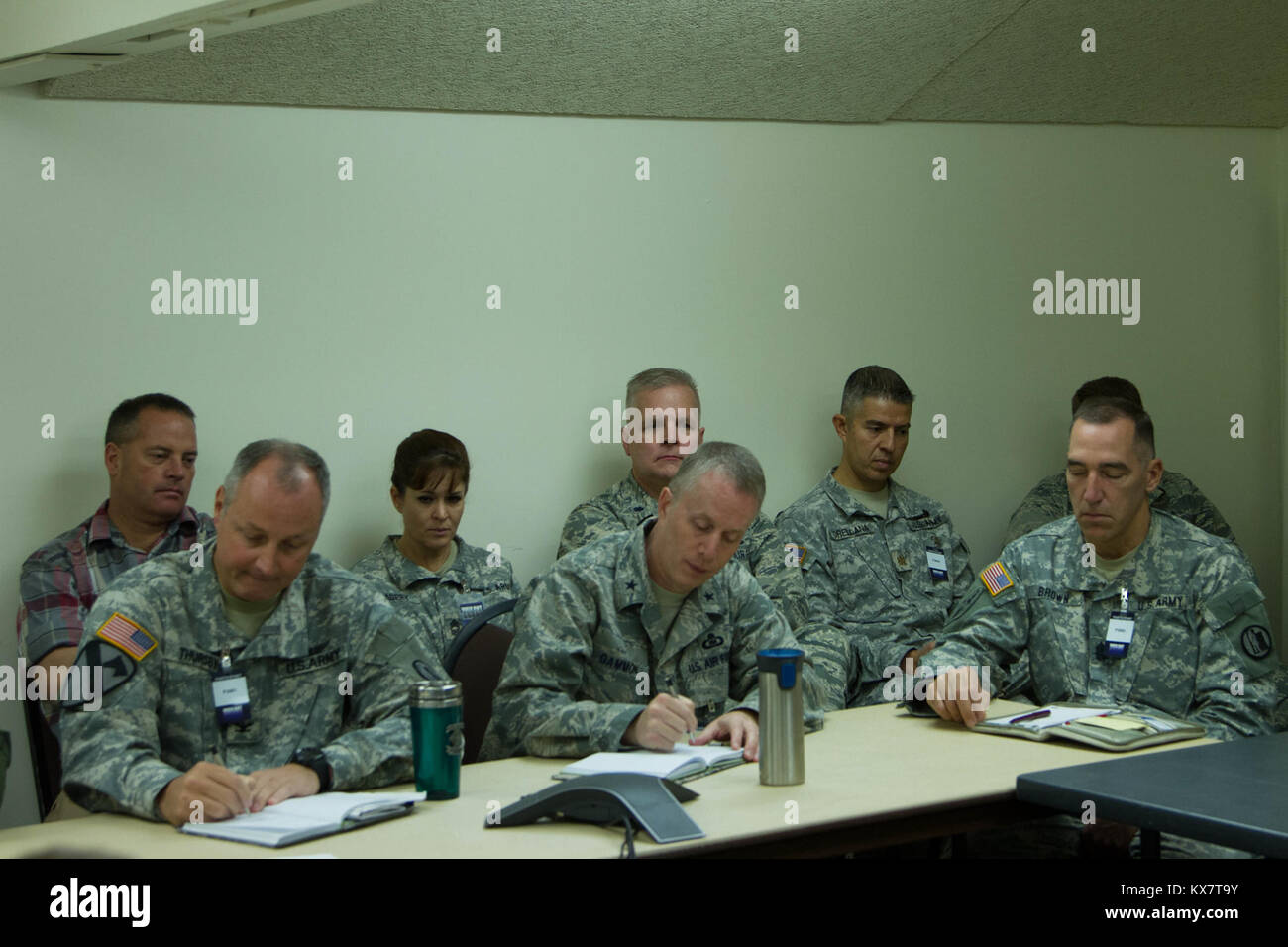 Senior staff that includes civilian, Army, and Air Force receive briefs ...