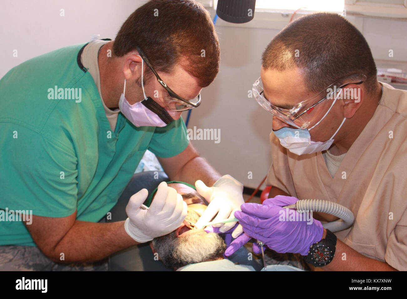 US Army National Guard medics. Doctor helping poor people Stock Photo ...