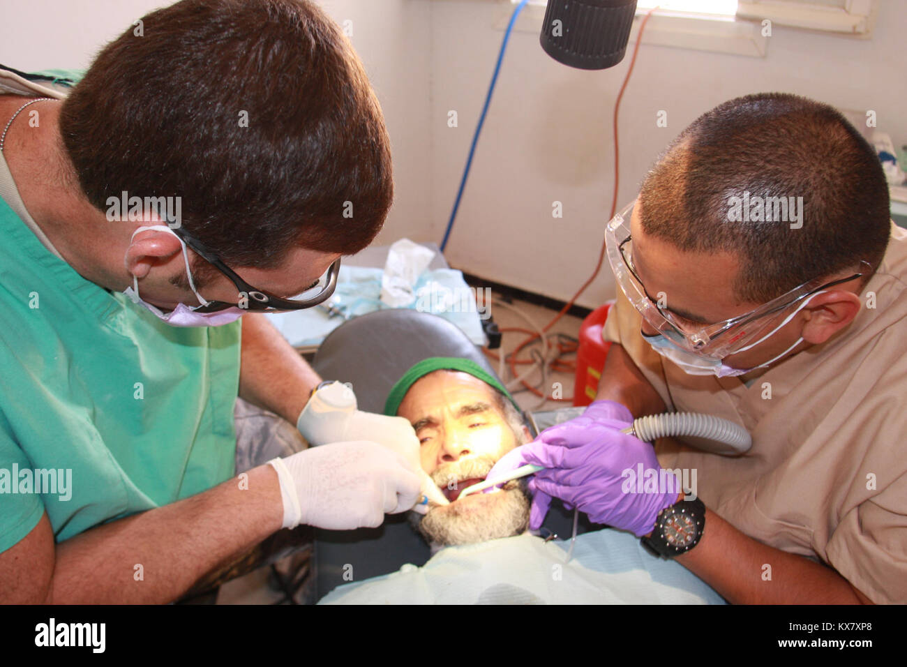 US Army National Guard medics. Doctor helping poor people Stock Photo ...