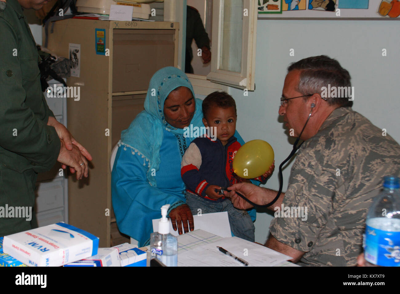 US Army National Guard medics. Doctor helping poor people Stock Photo ...