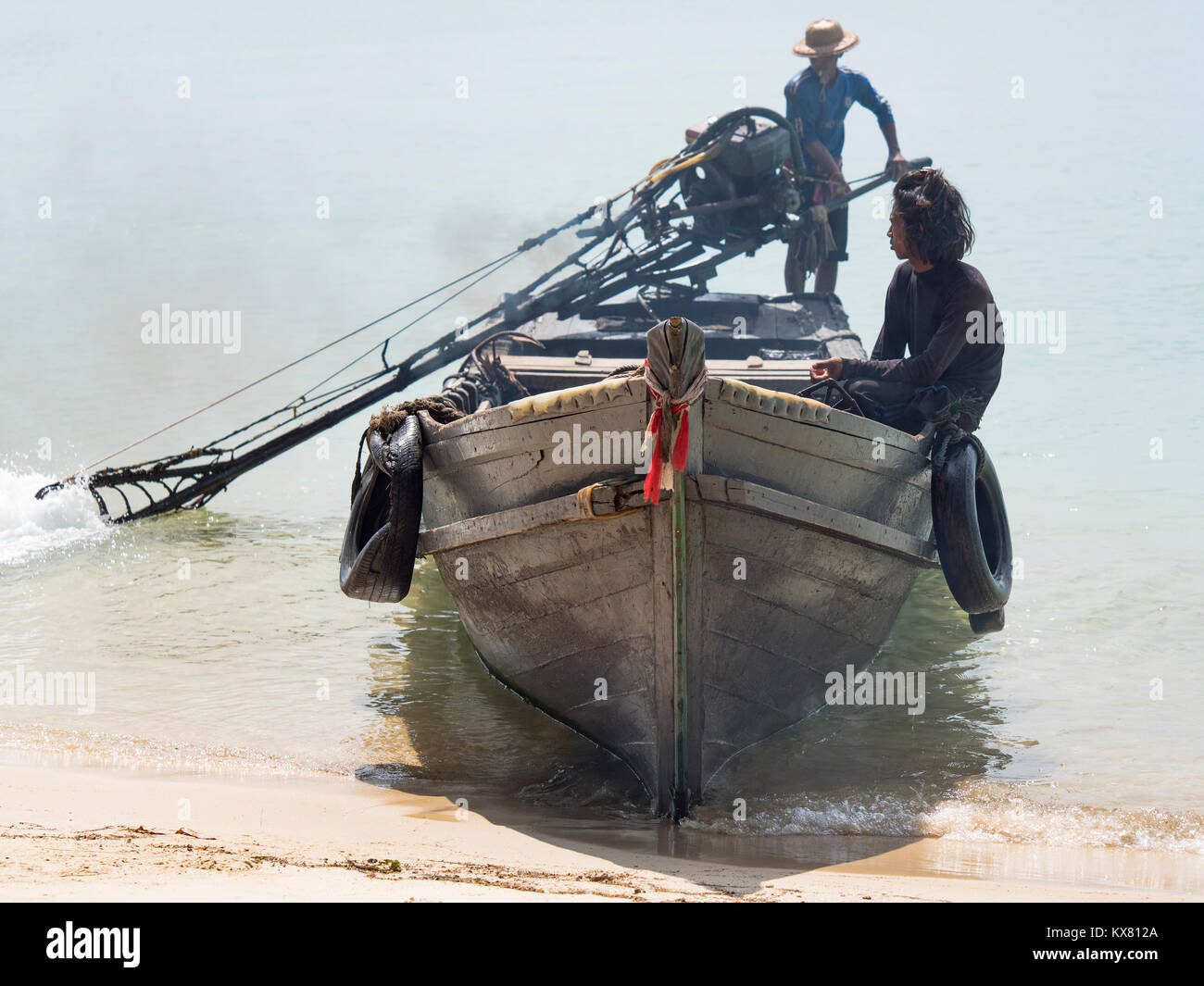 Islanders and their boat at Dome Island outside Myeik, a part of the ...