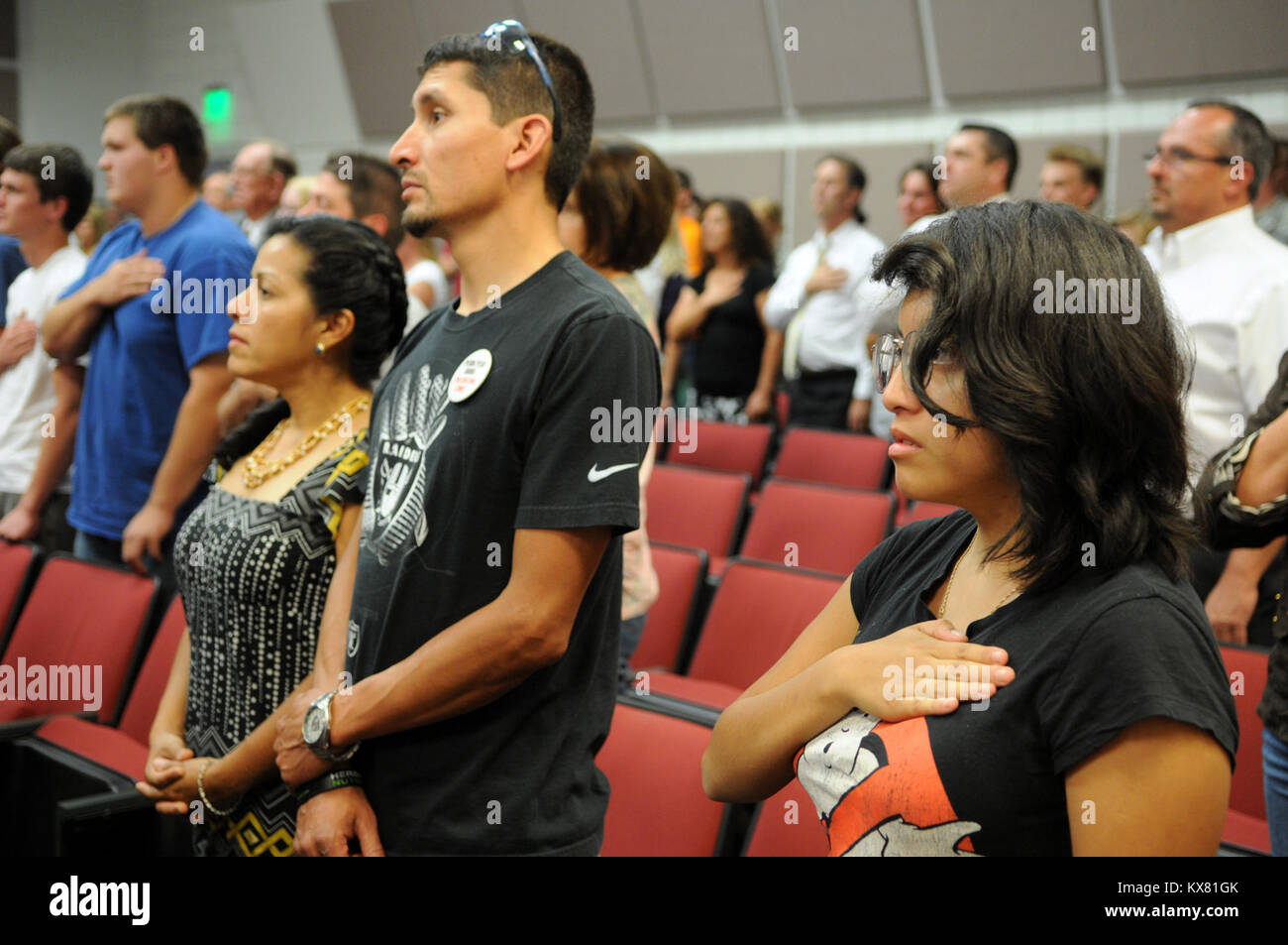 Student delegates stand as the National Anthem plays during the kick ...