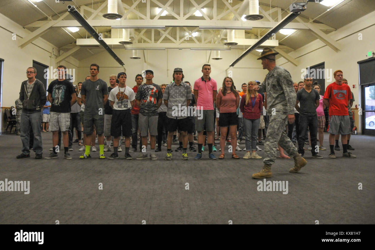 US Army National Guard event with young people, drill sergeant shouts ...