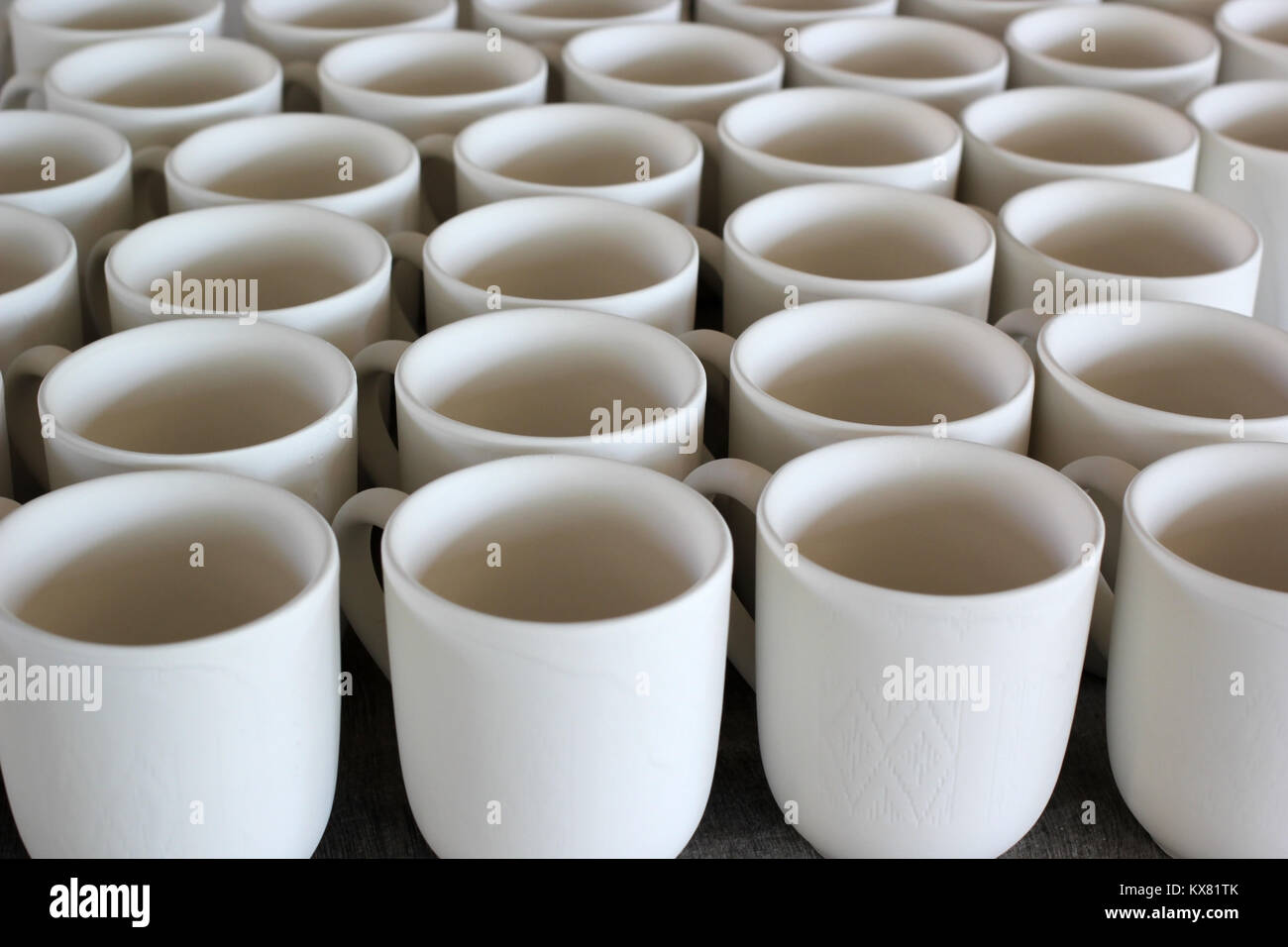 ceramic cups under production in pottery workshop Stock Photo - Alamy