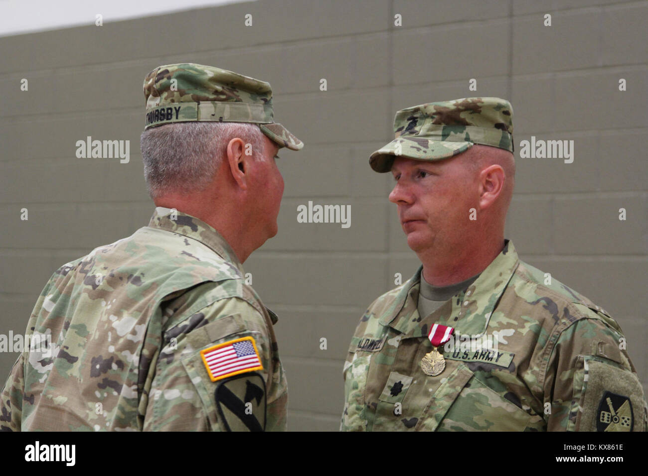 Col. Todd Thursby, 65th Field Artillery Brigade commander, presents ...