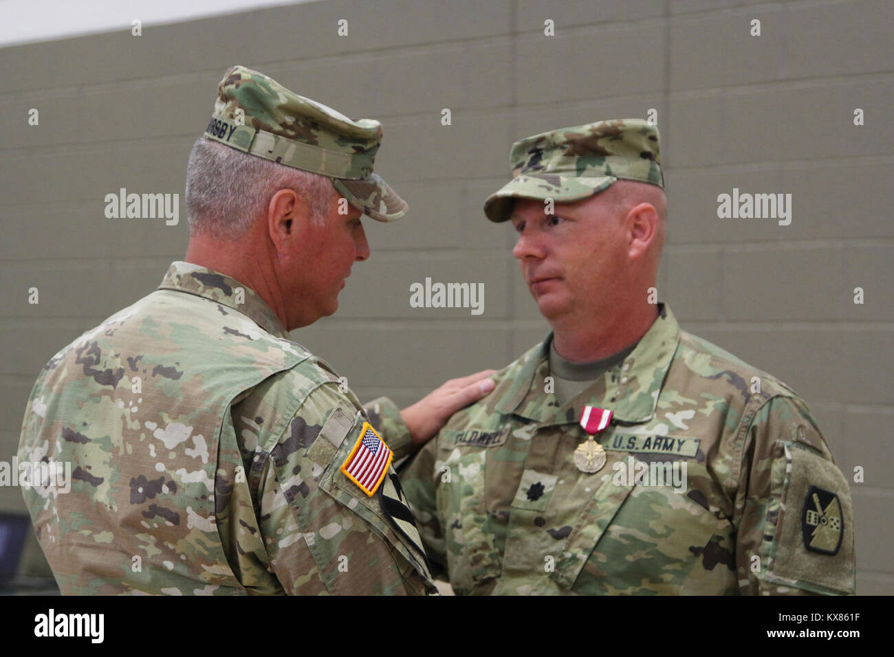 Col. Todd Thursby, 65th Field Artillery Brigade commander, presents ...