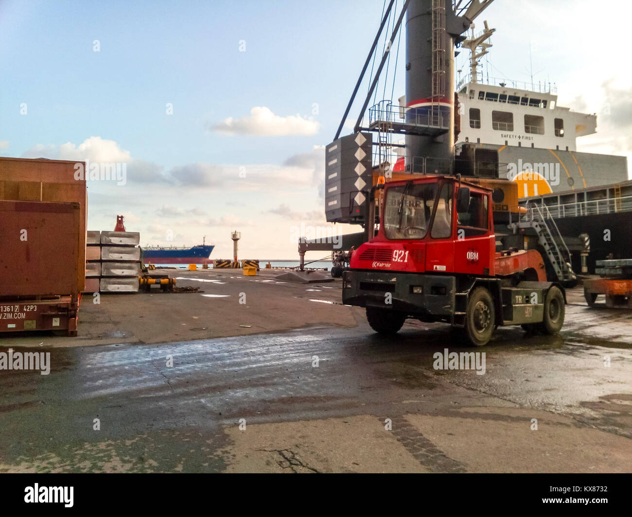 The port loader in the port drives around the site Stock Photo - Alamy