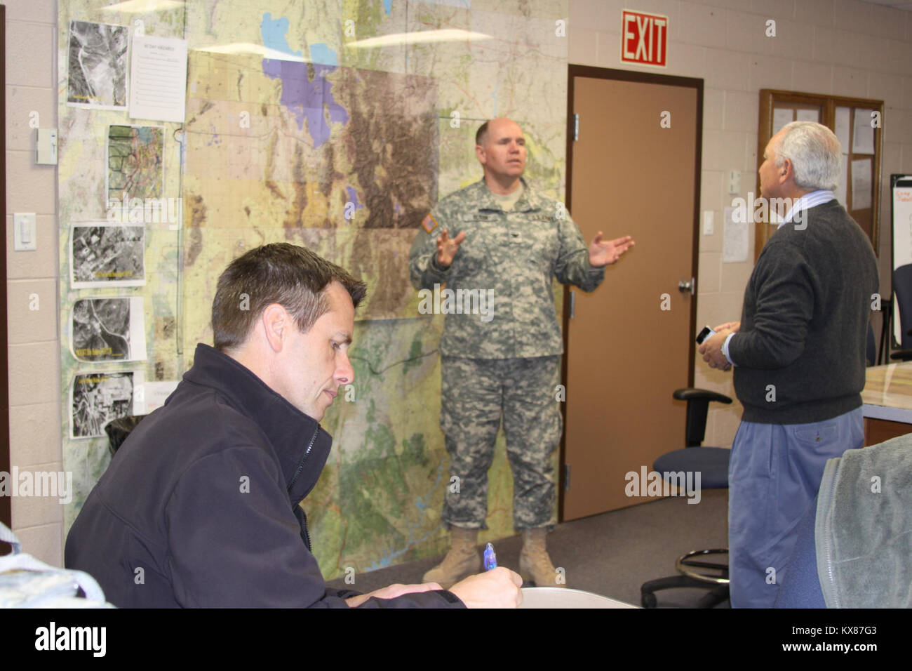 US Army National Guard assisting people in need. Helping in the field ...