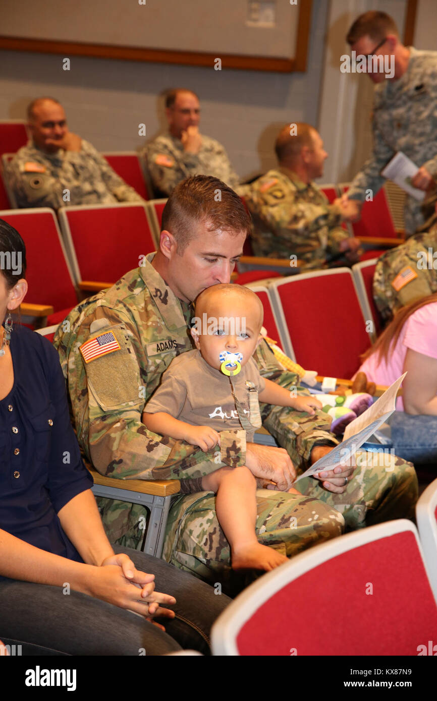 US Army National Guard with family at awards and promotion presentation ...