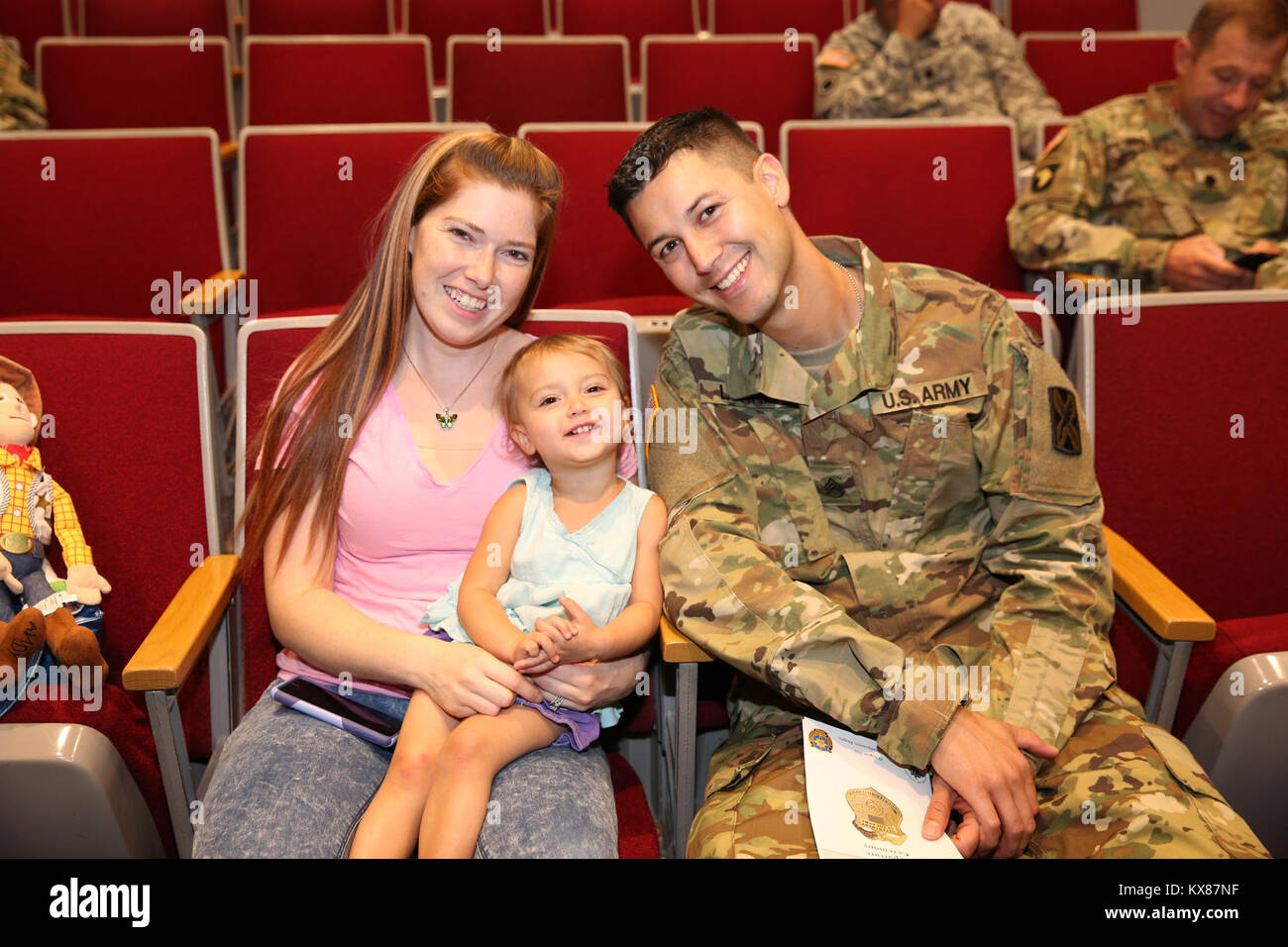 US Army National Guard with family at awards and promotion presentation ...