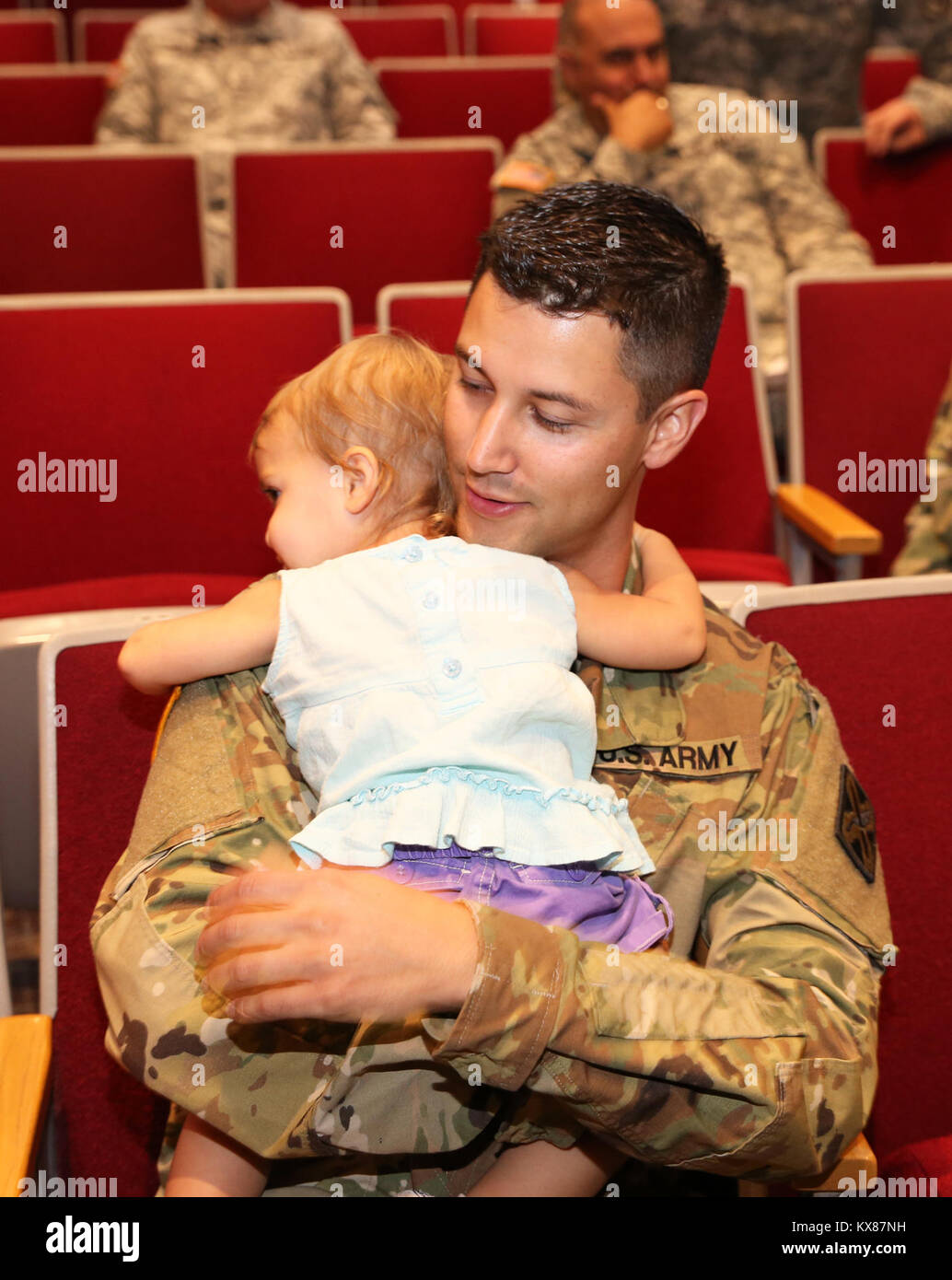 US Army National Guard with family at awards and promotion presentation ...