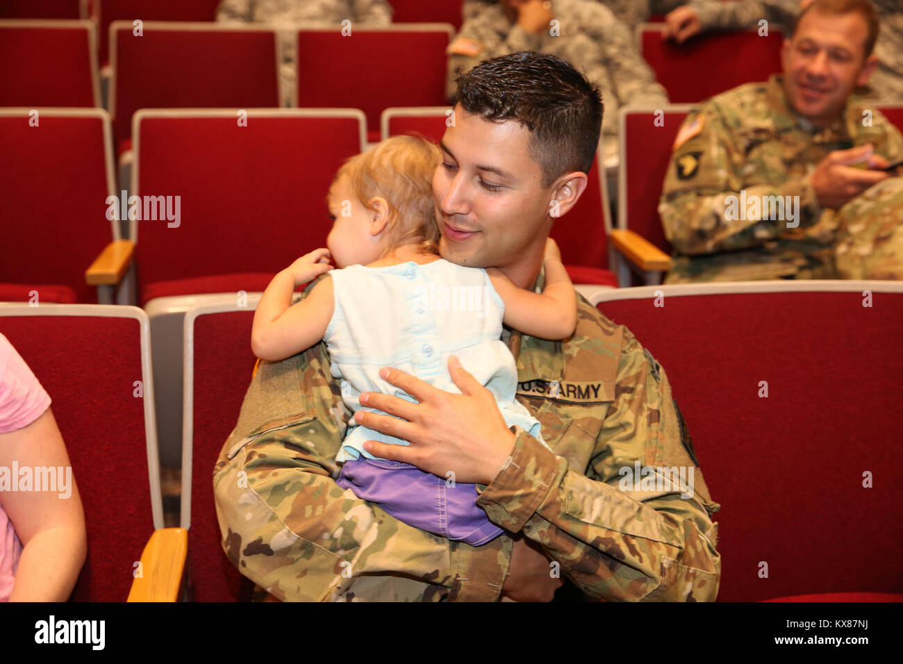 US Army National Guard with family at awards and promotion presentation ...