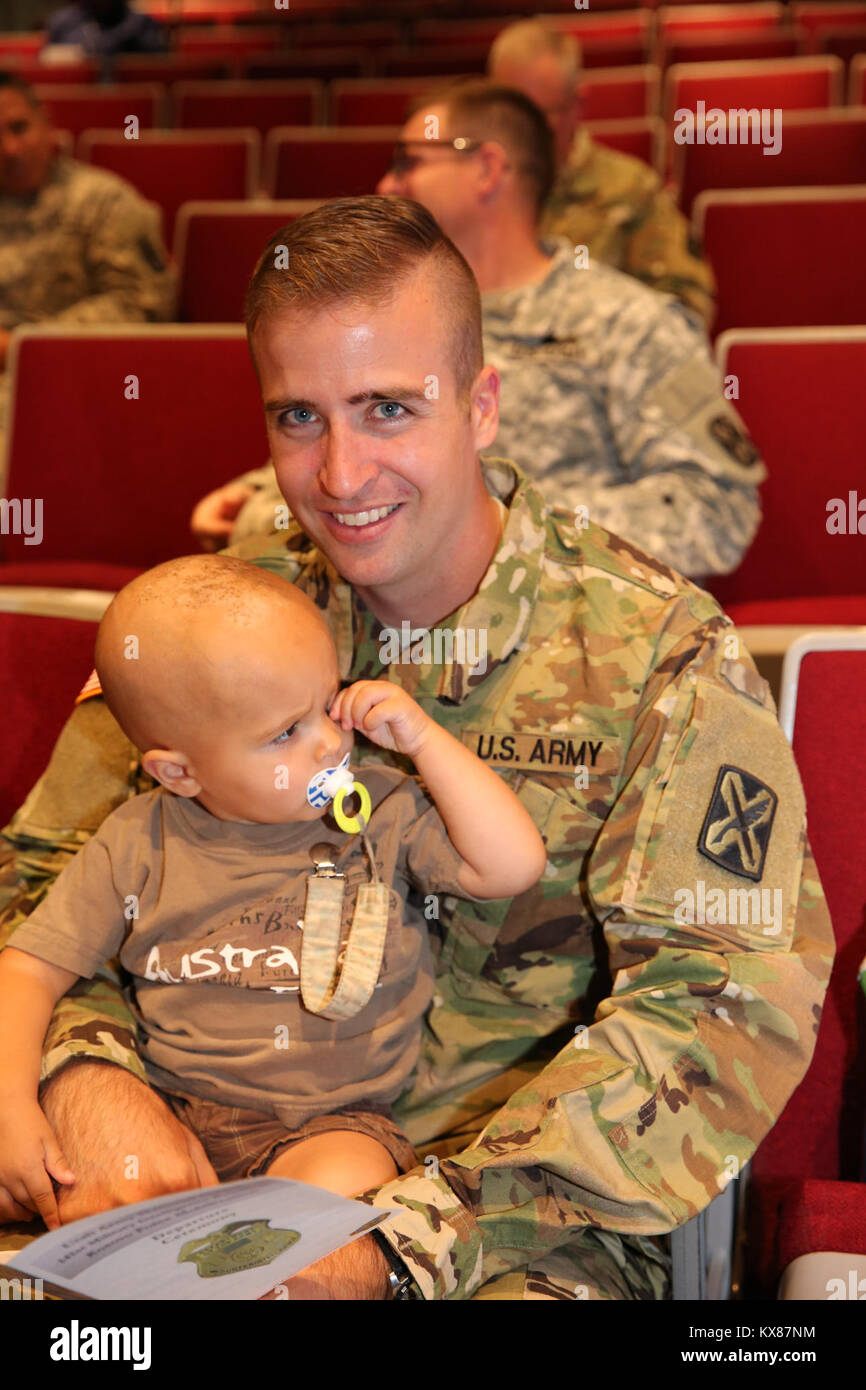 US Army National Guard with family at awards and promotion presentation ...