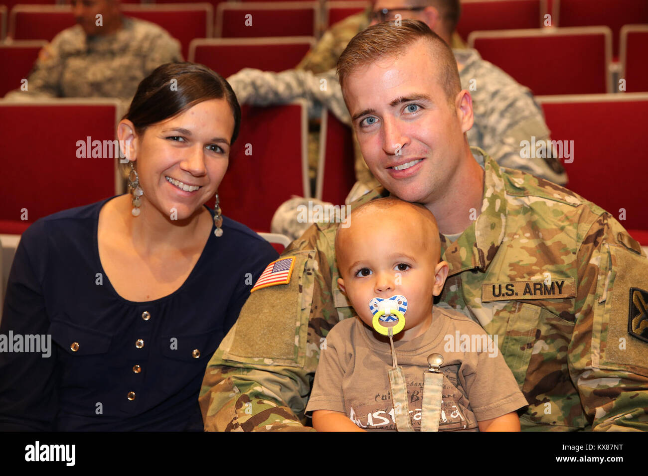 US Army National Guard with family at awards and promotion presentation ...