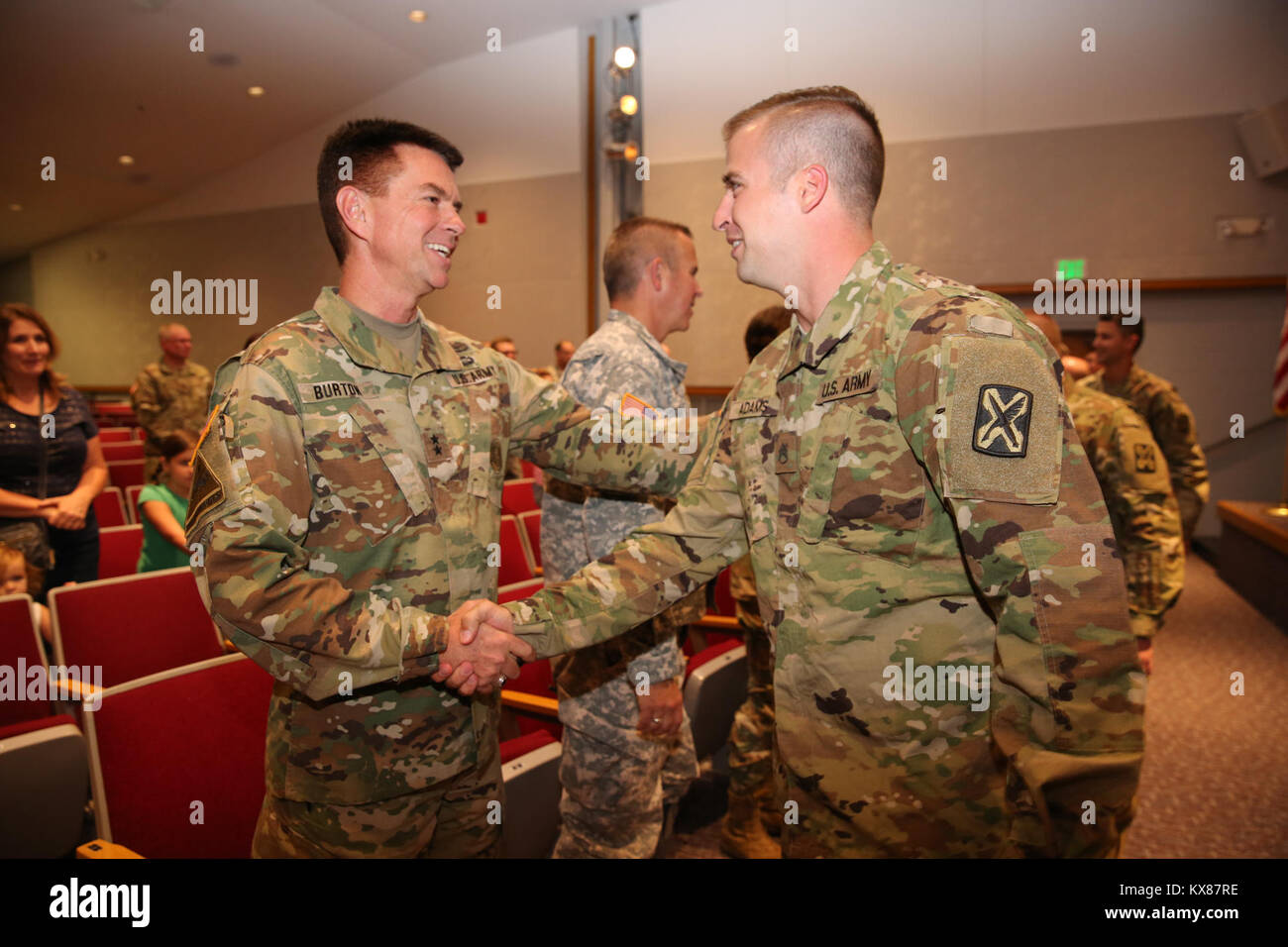 US Army National Guard with family at awards and promotion presentation ...