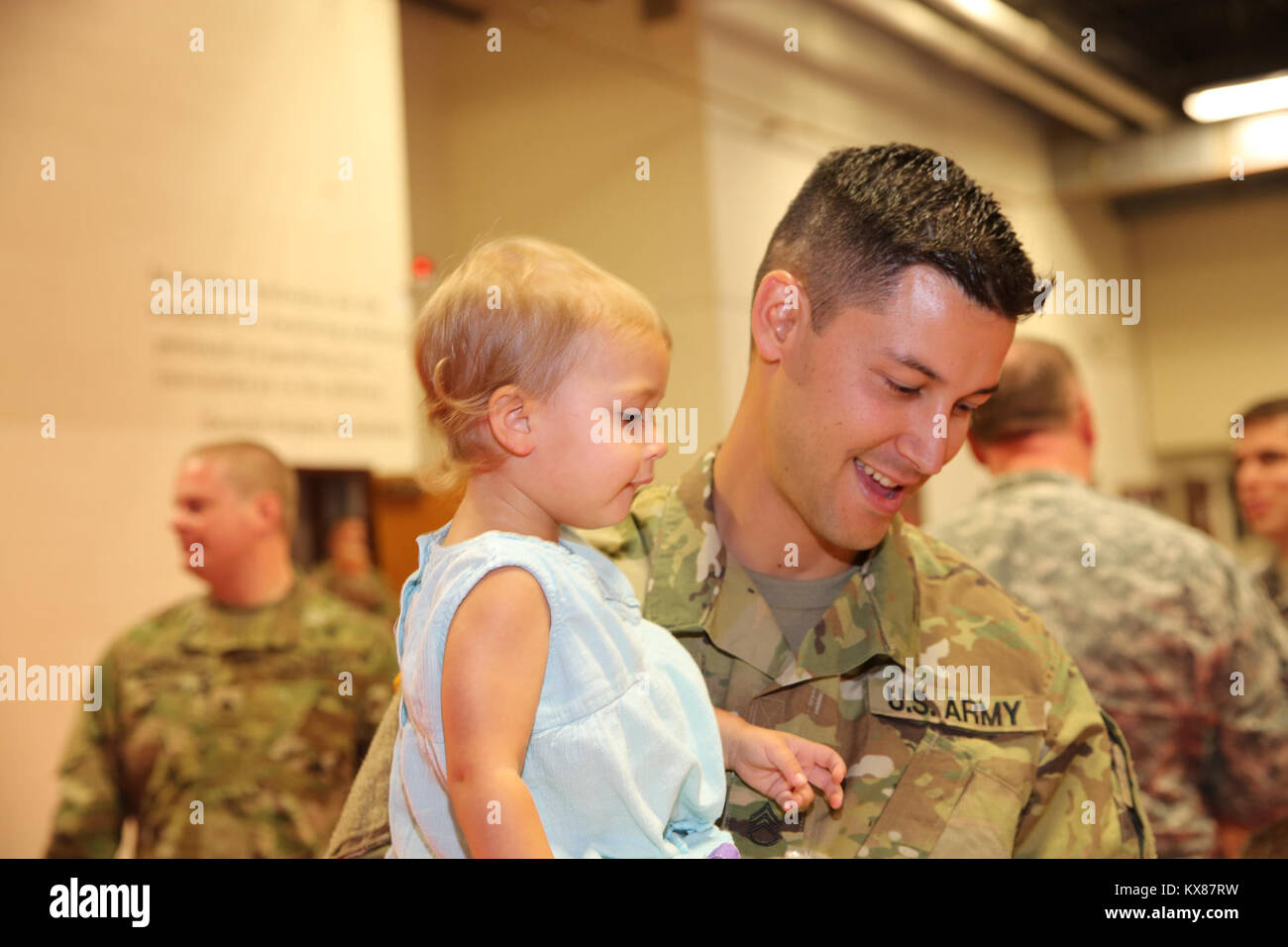 US Army National Guard with family at awards and promotion presentation ...