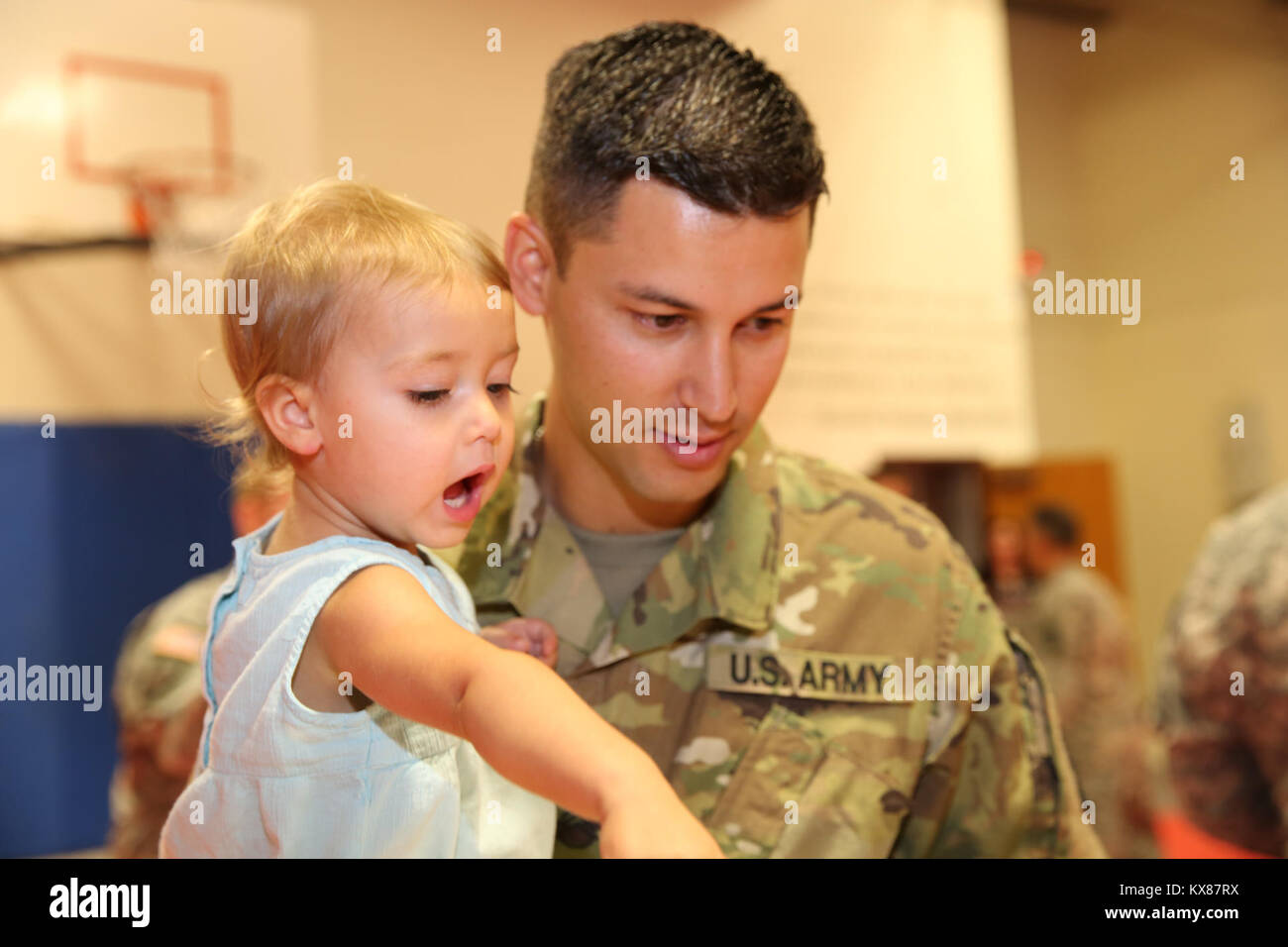 US Army National Guard with family at awards and promotion presentation ...