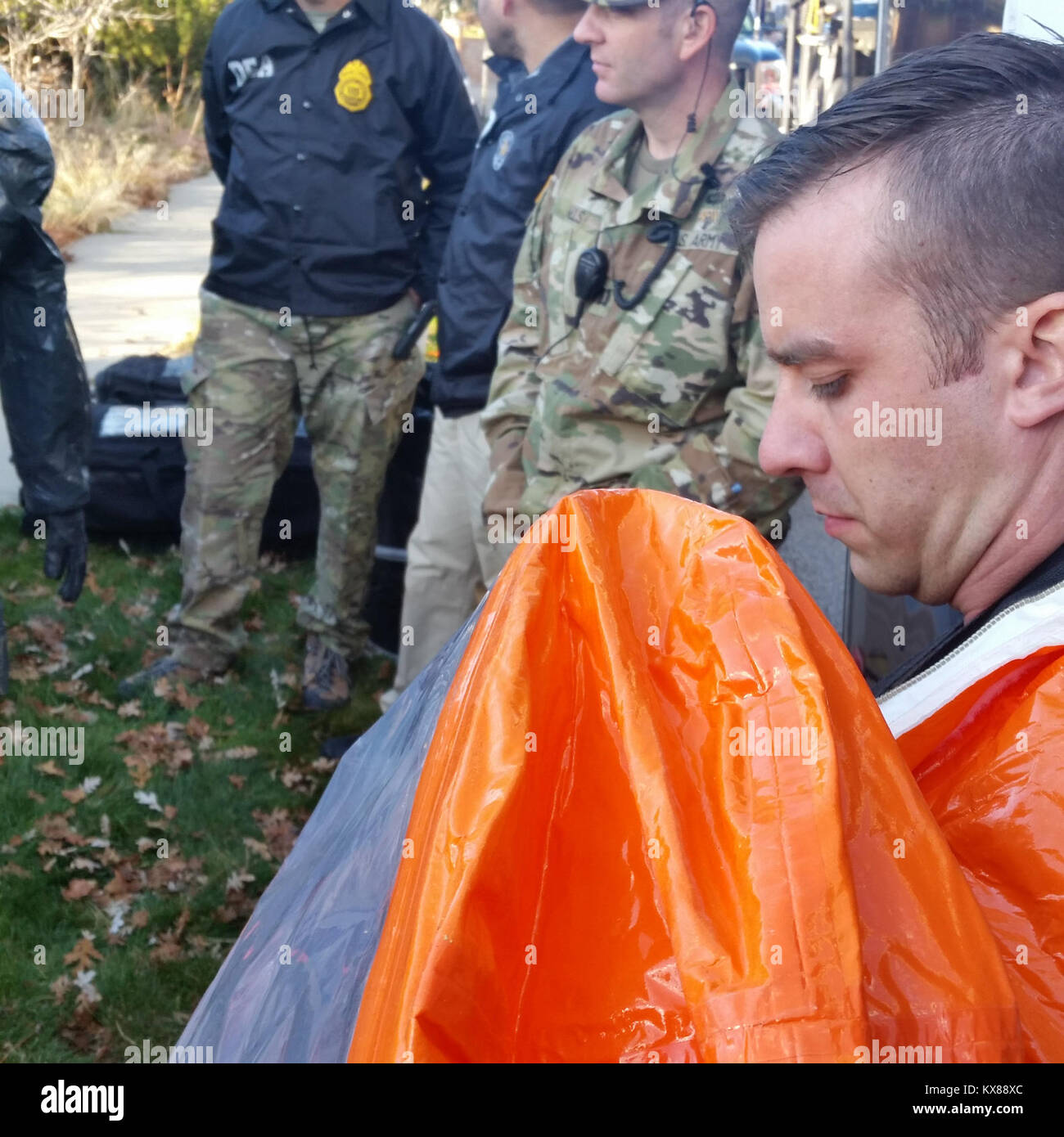 US Army National Guard assisting people in need. Helping in the field ...