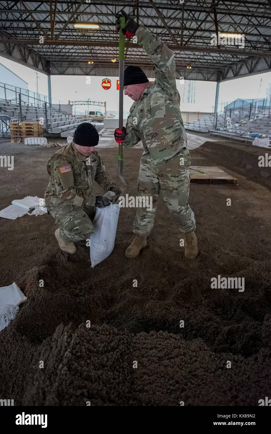Utah National Guard Soldiers and Airmen fill sand bags at the Box Elder ...