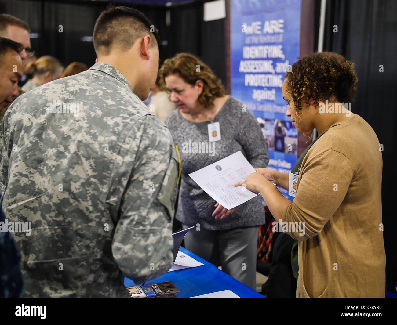 US Army National Guard assisting people in need. Helping in the field ...