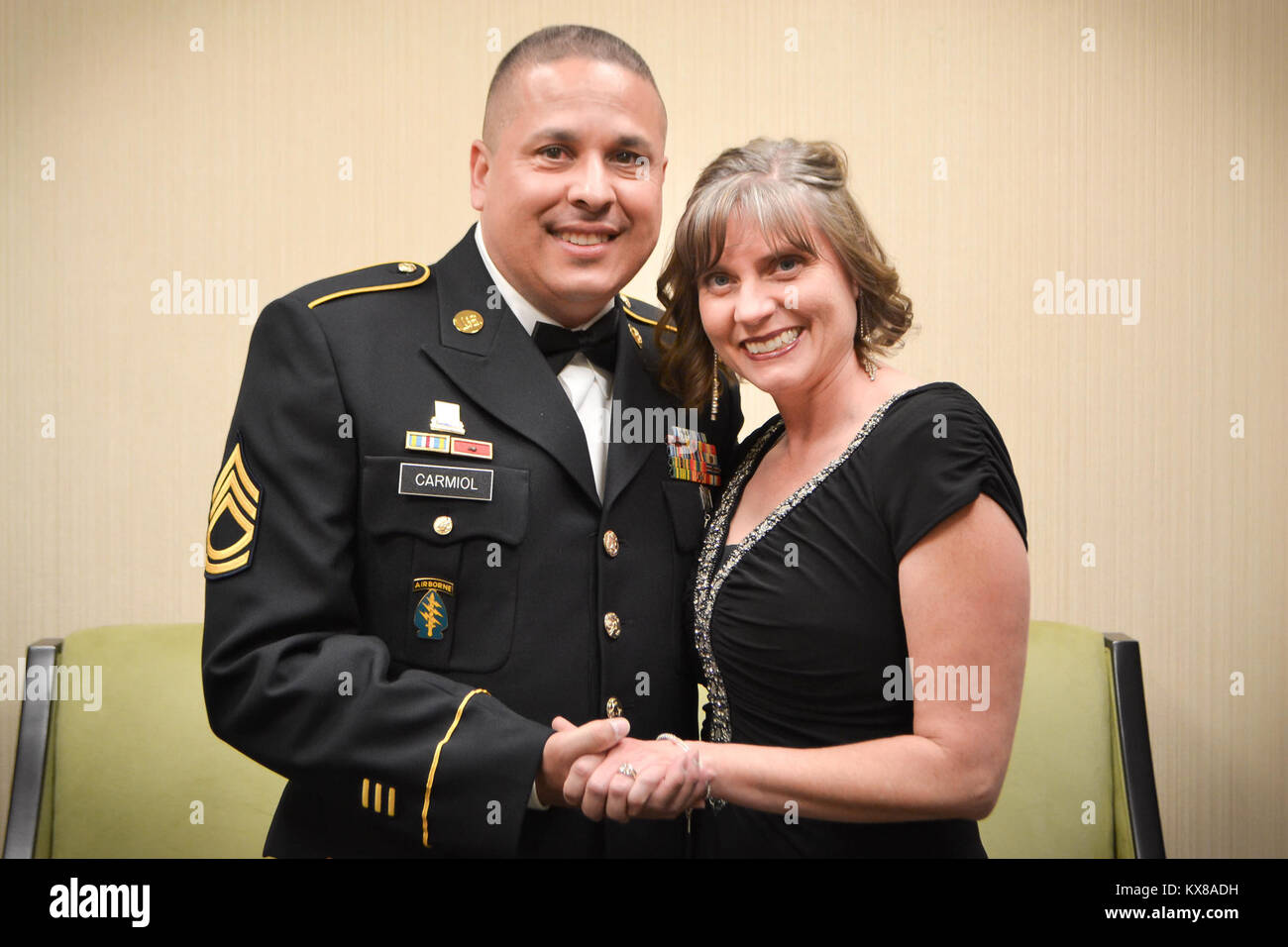 US military National Guard personnel with family and partners at awards ...