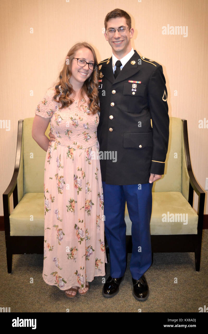 US military National Guard personnel with family and partners at awards ...