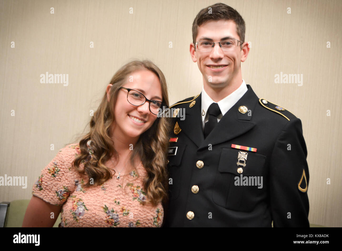 US military National Guard personnel with family and partners at awards ...