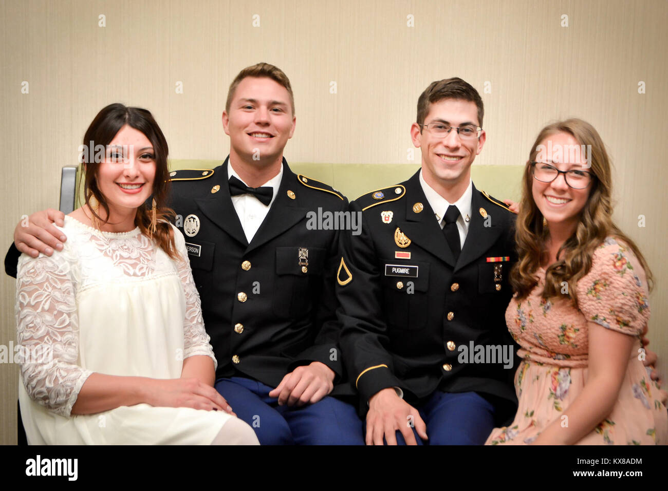 US military National Guard personnel with family and partners at awards ...