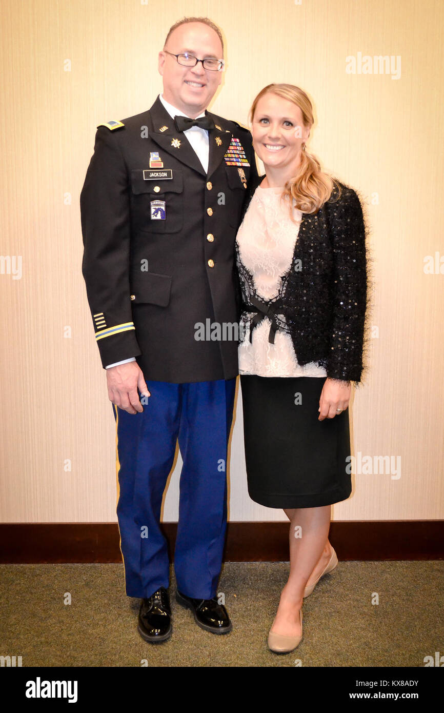 US military National Guard personnel with family and partners at awards ...