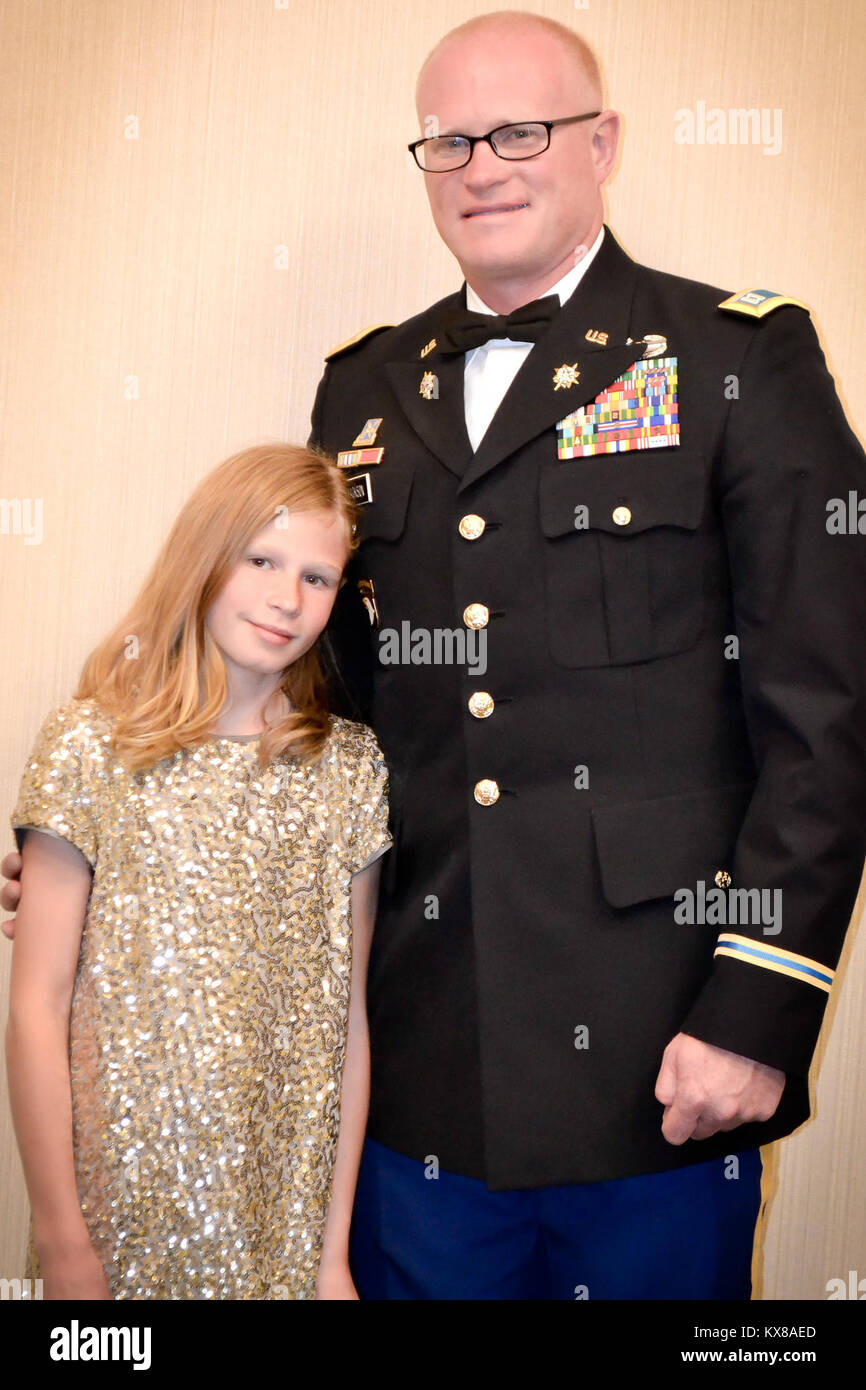 US military National Guard personnel with family and partners at awards ...