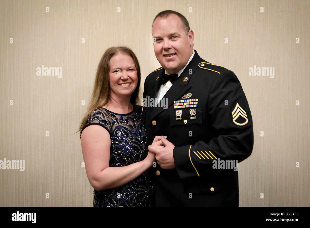 US military National Guard personnel with family and partners at awards ...
