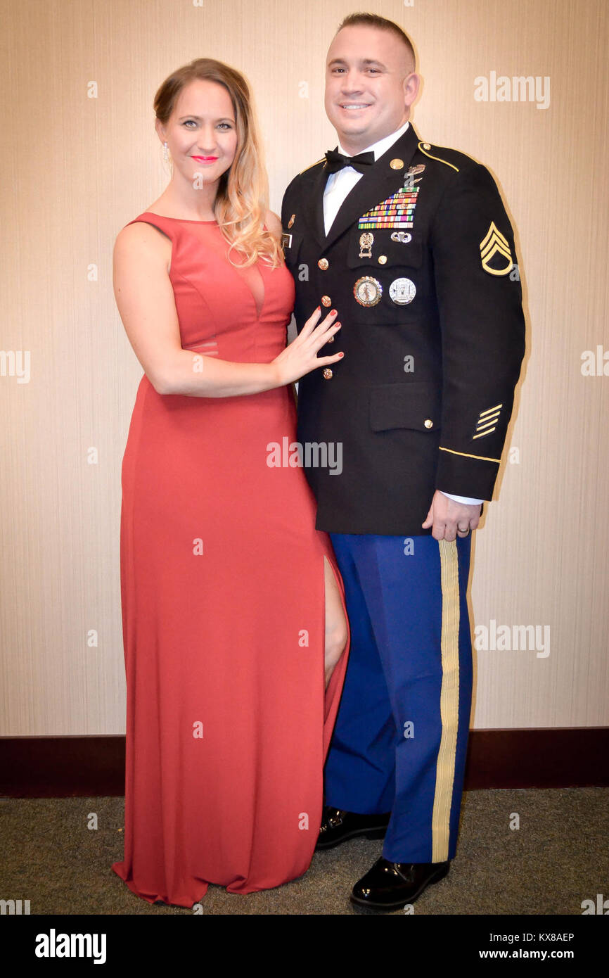 US military National Guard personnel with family and partners at awards ...