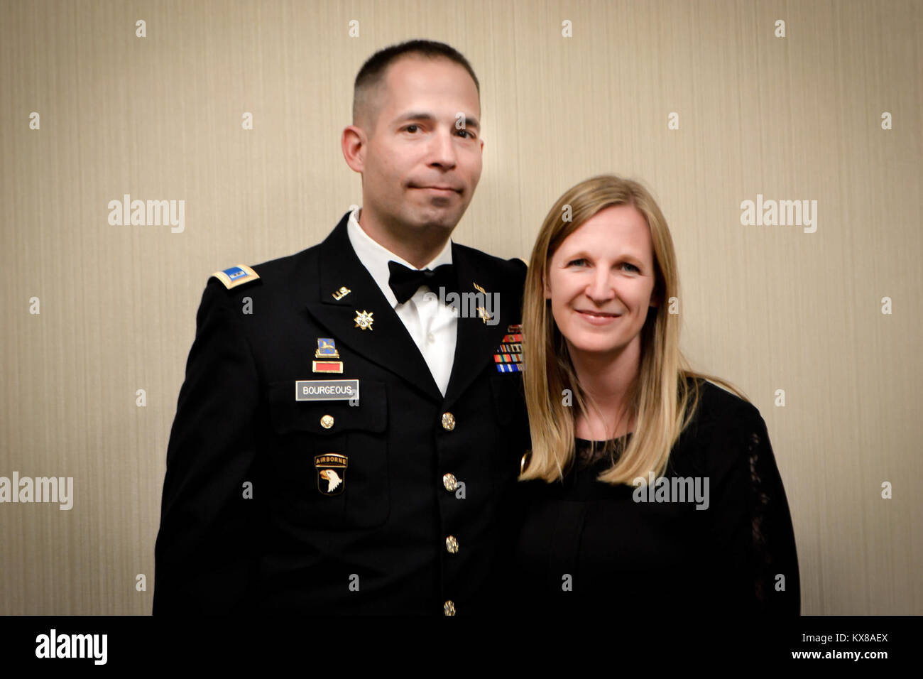 US military National Guard personnel with family and partners at awards ...