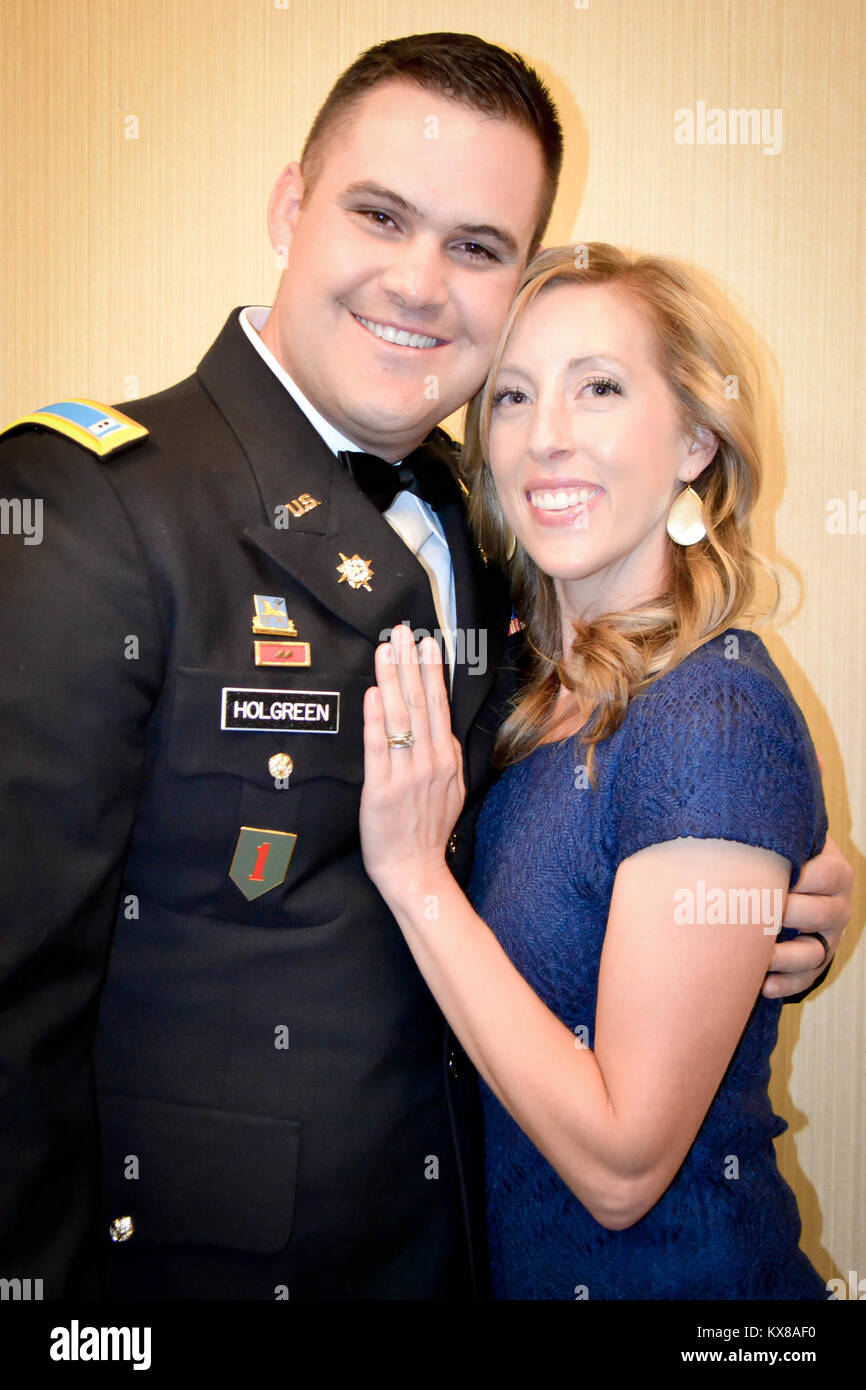 US military National Guard personnel with family and partners at awards ...