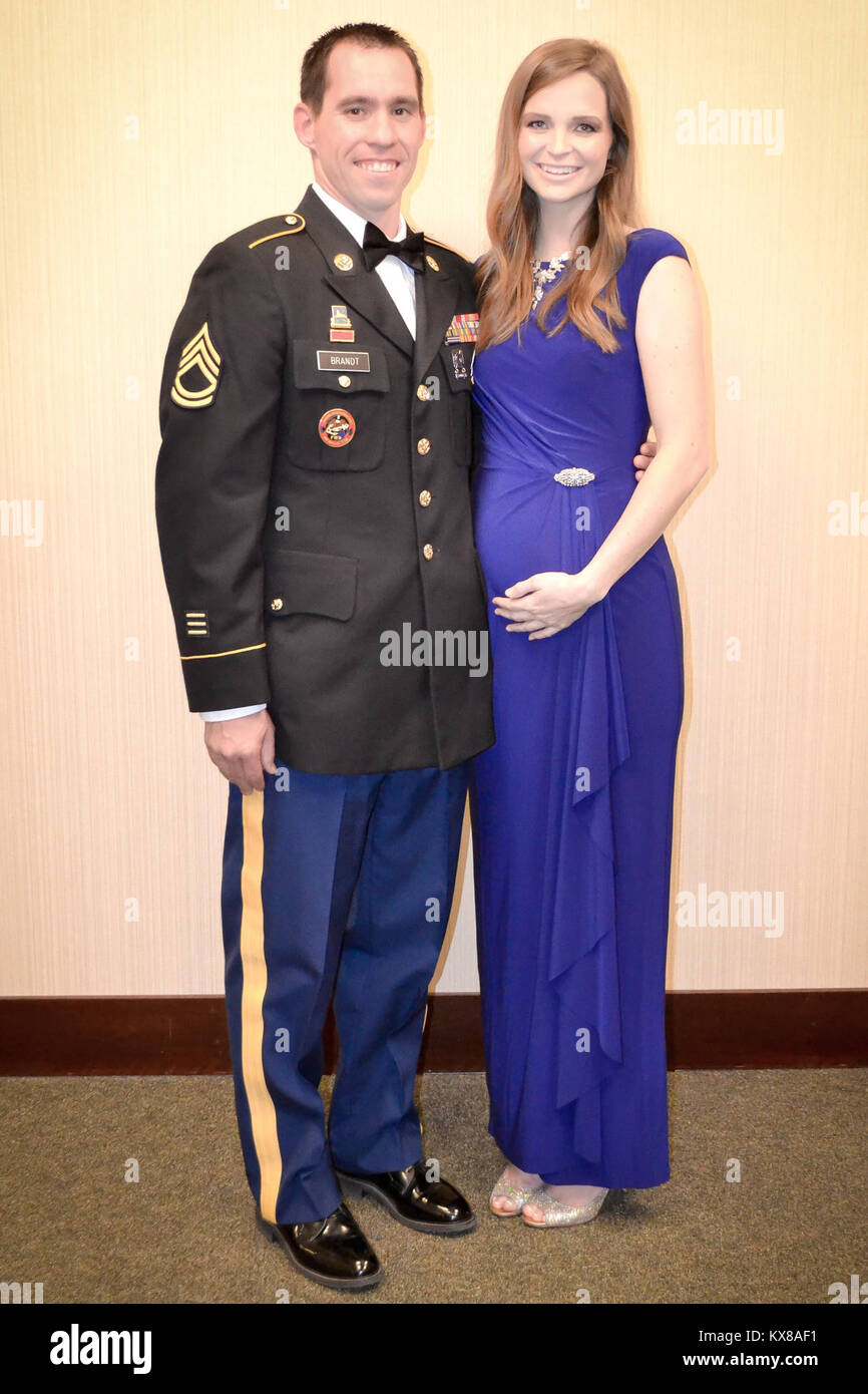 US military National Guard personnel with family and partners at awards ...