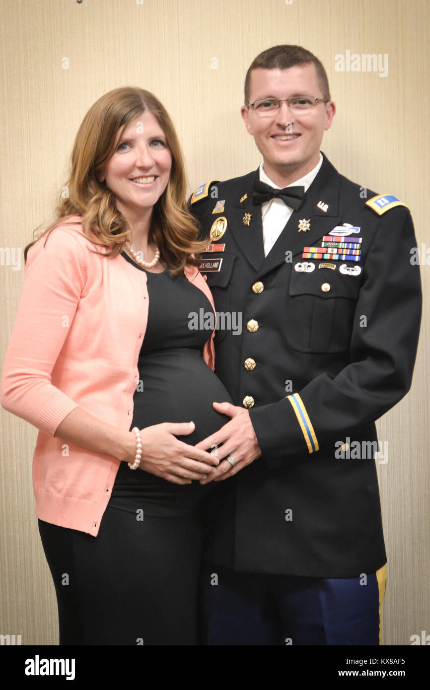 US military National Guard personnel with family and partners at awards ...