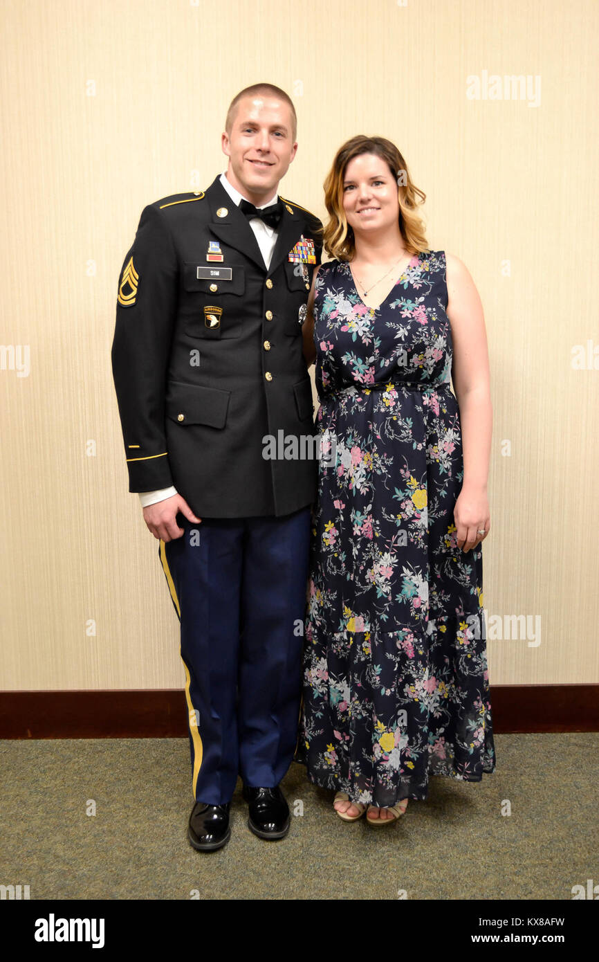 US military National Guard personnel with family and partners at awards ...