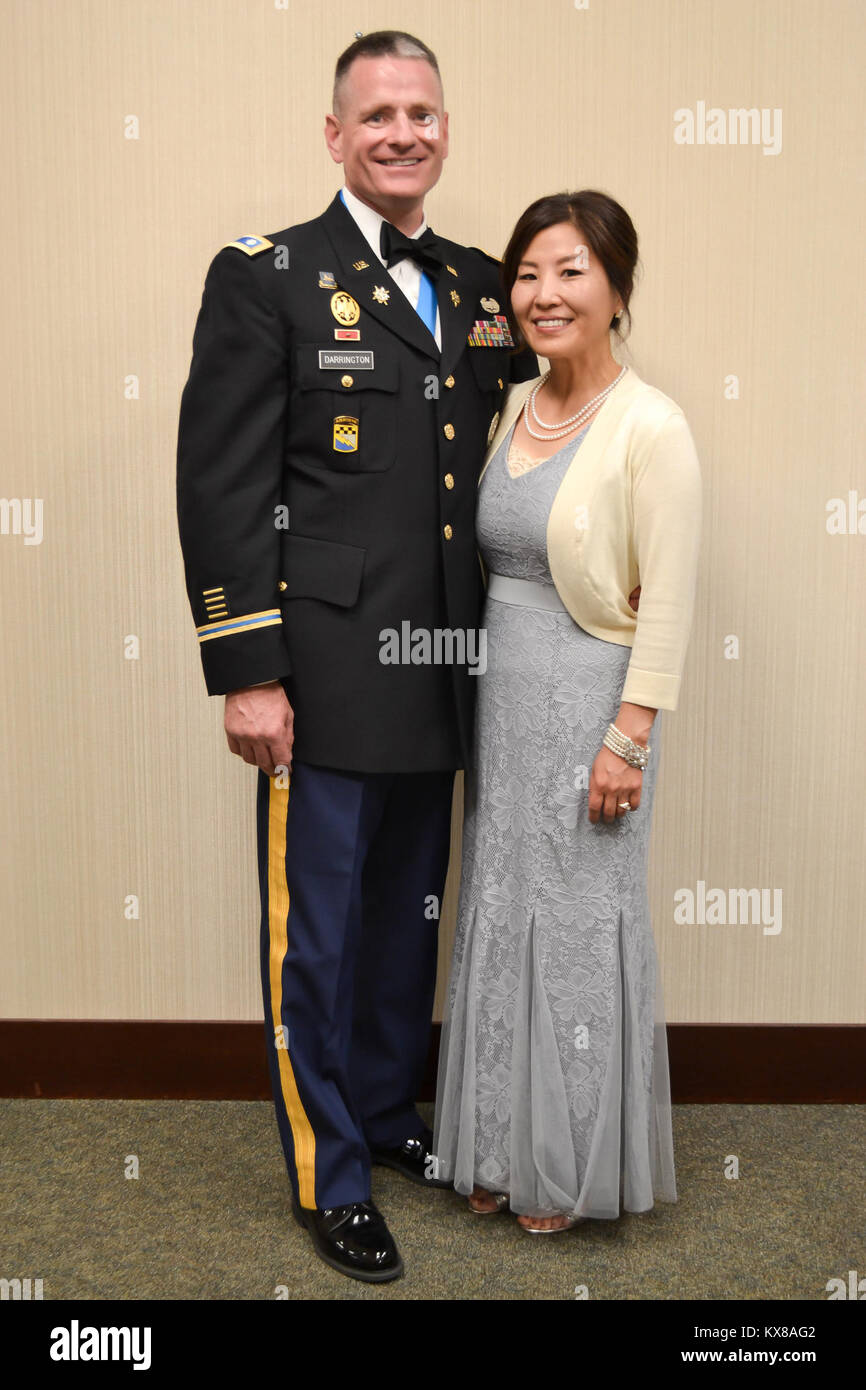 US military National Guard personnel with family and partners at awards ...