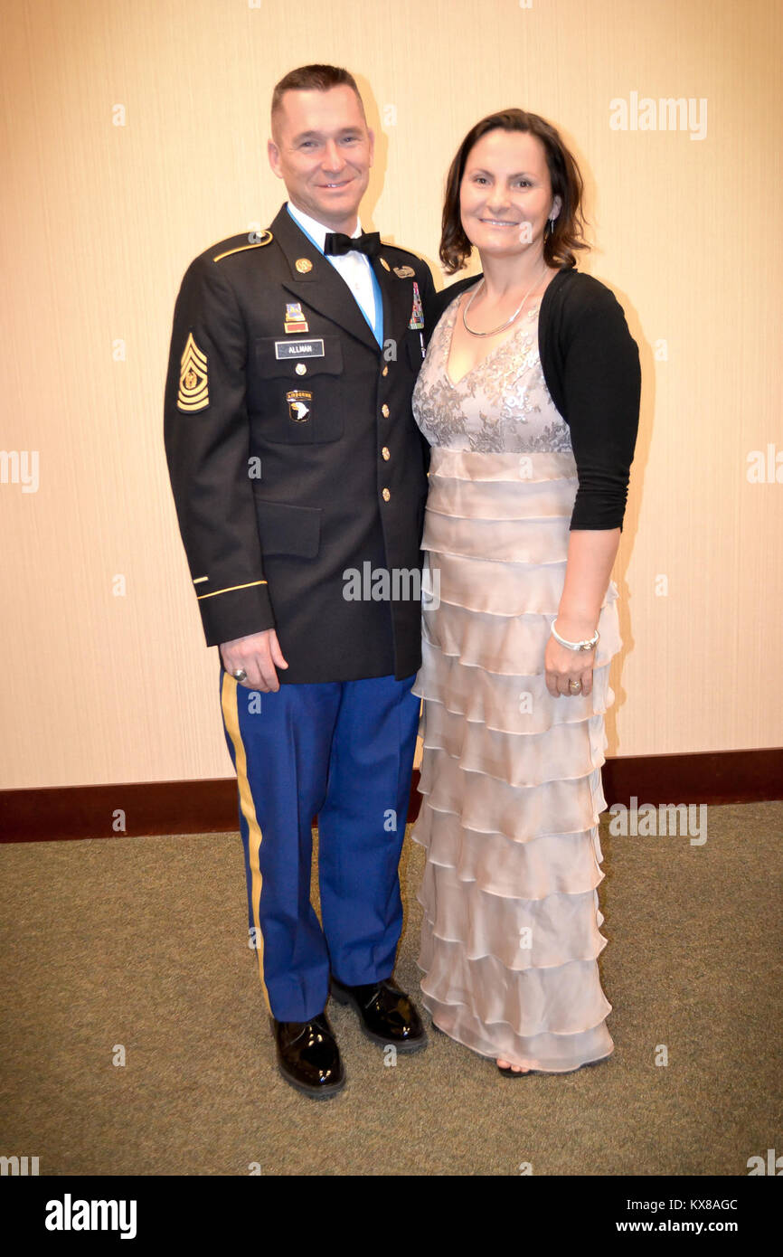 US military National Guard personnel with family and partners at awards ...