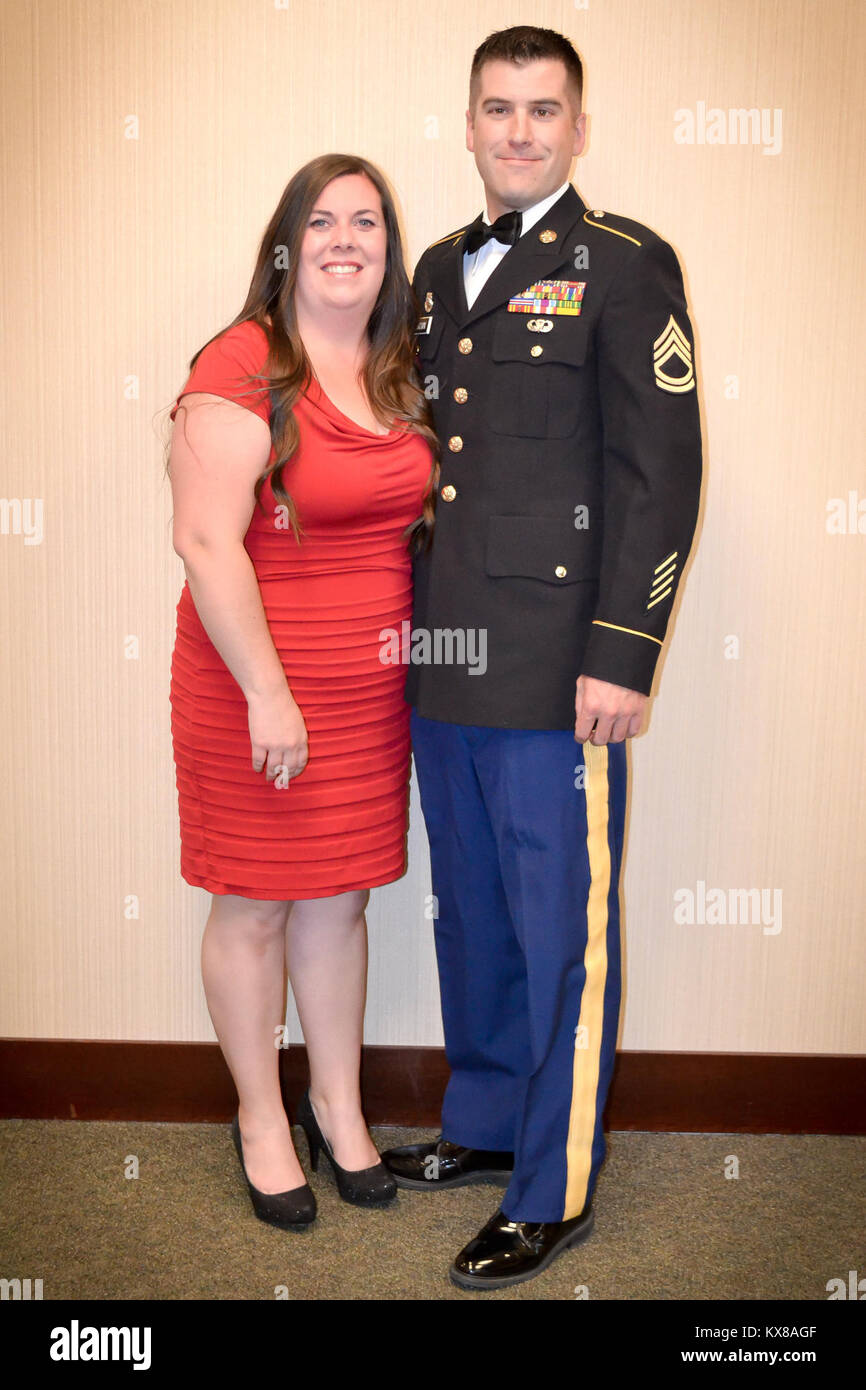 US military National Guard personnel with family and partners at awards ...
