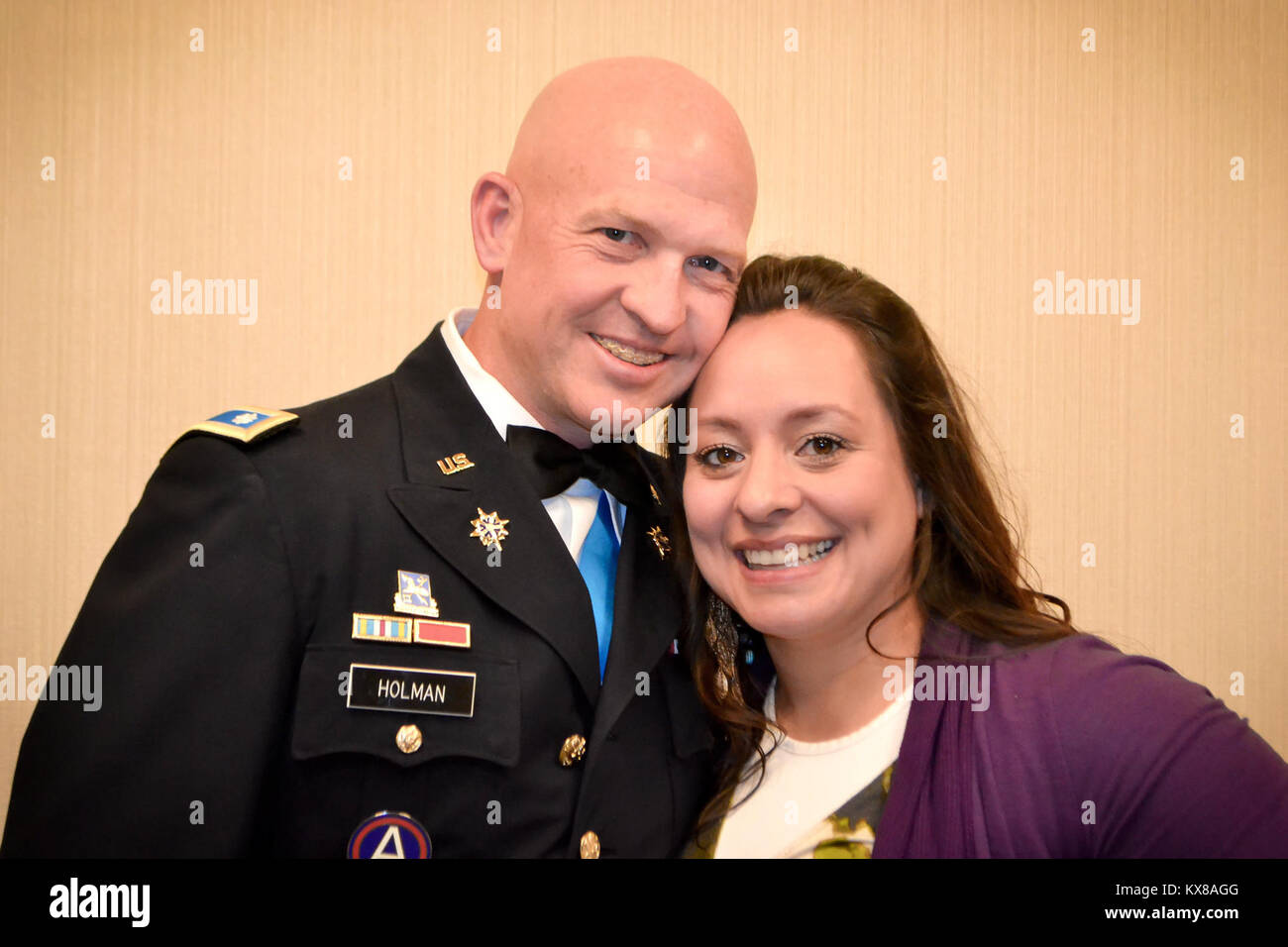 US military National Guard personnel with family and partners at awards ...