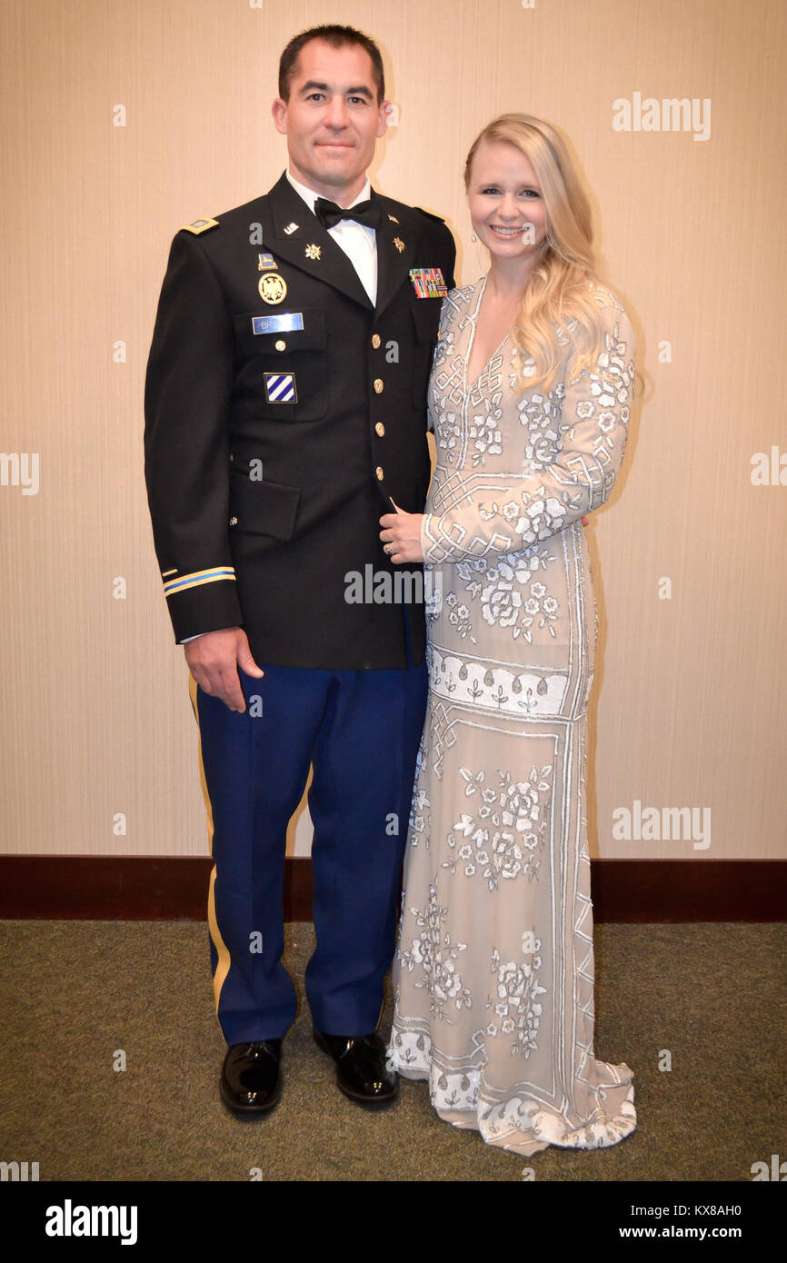 US military National Guard personnel with family and partners at awards ...