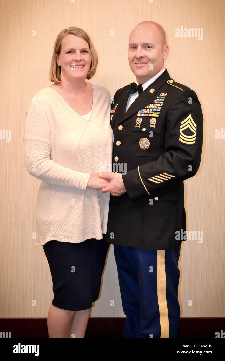 US military National Guard personnel with family and partners at awards ...